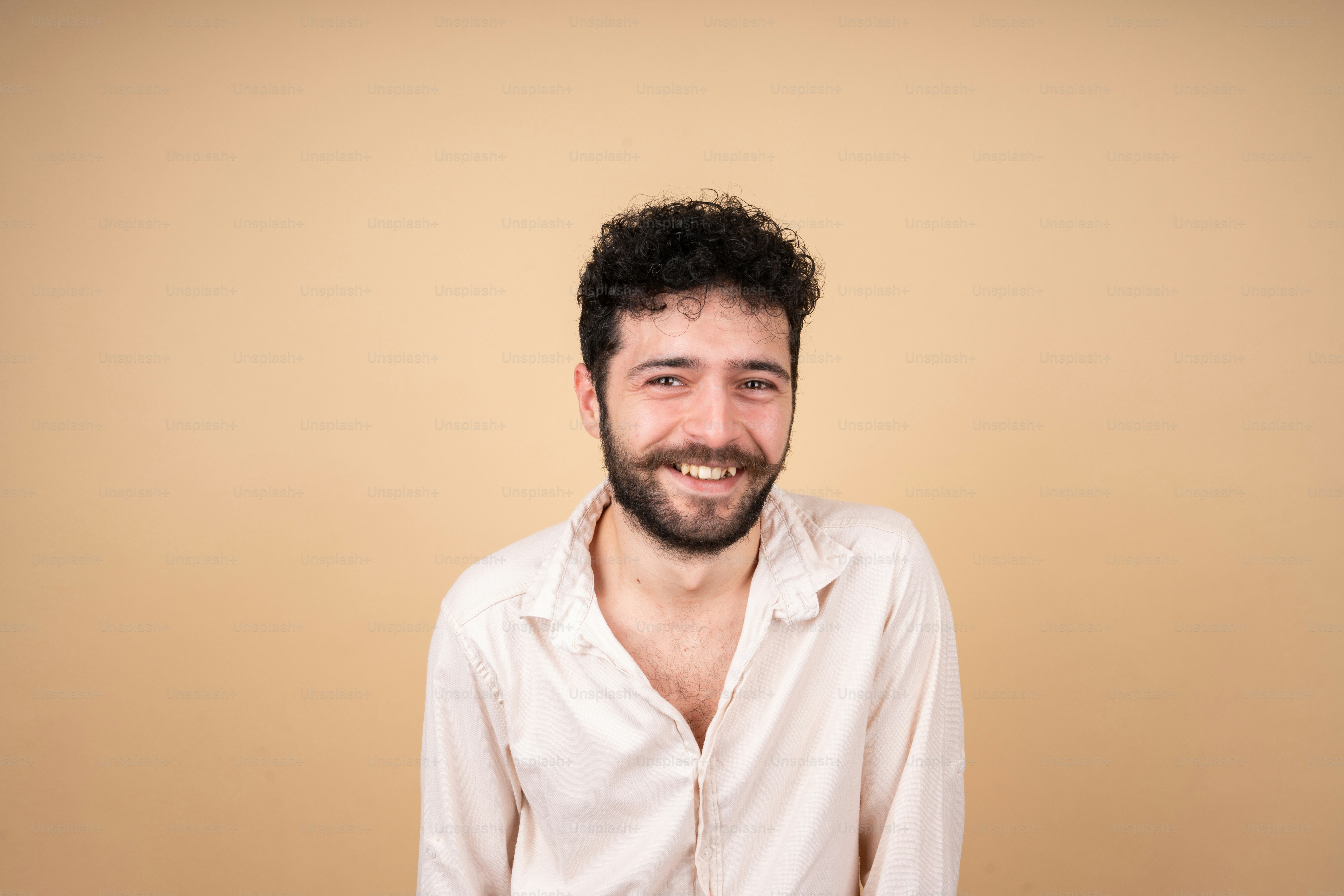 A man with a beard smiling for the camera photo – Happy emotions Image ...