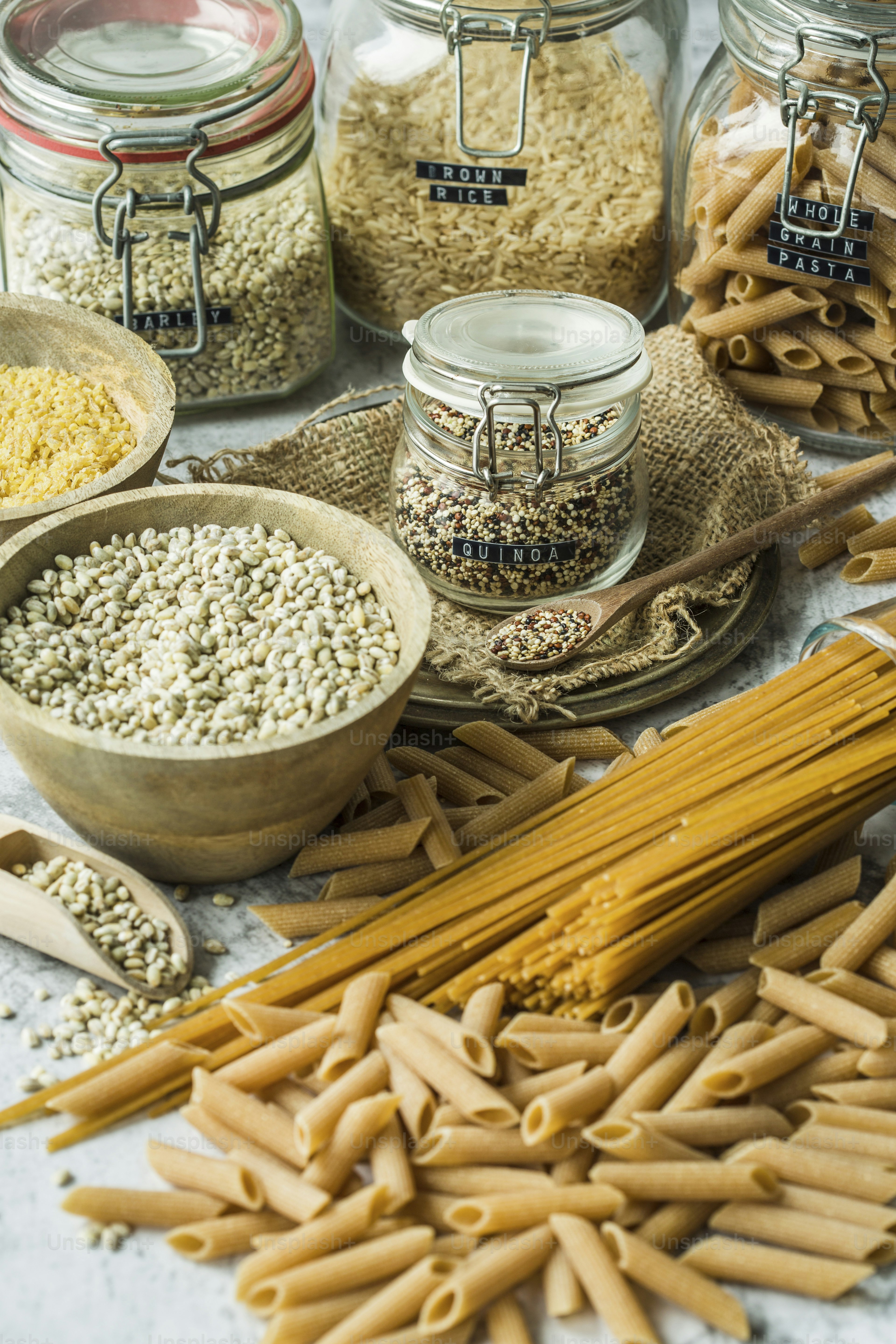 A table topped with lots of different types of pasta photo – Pasta ...