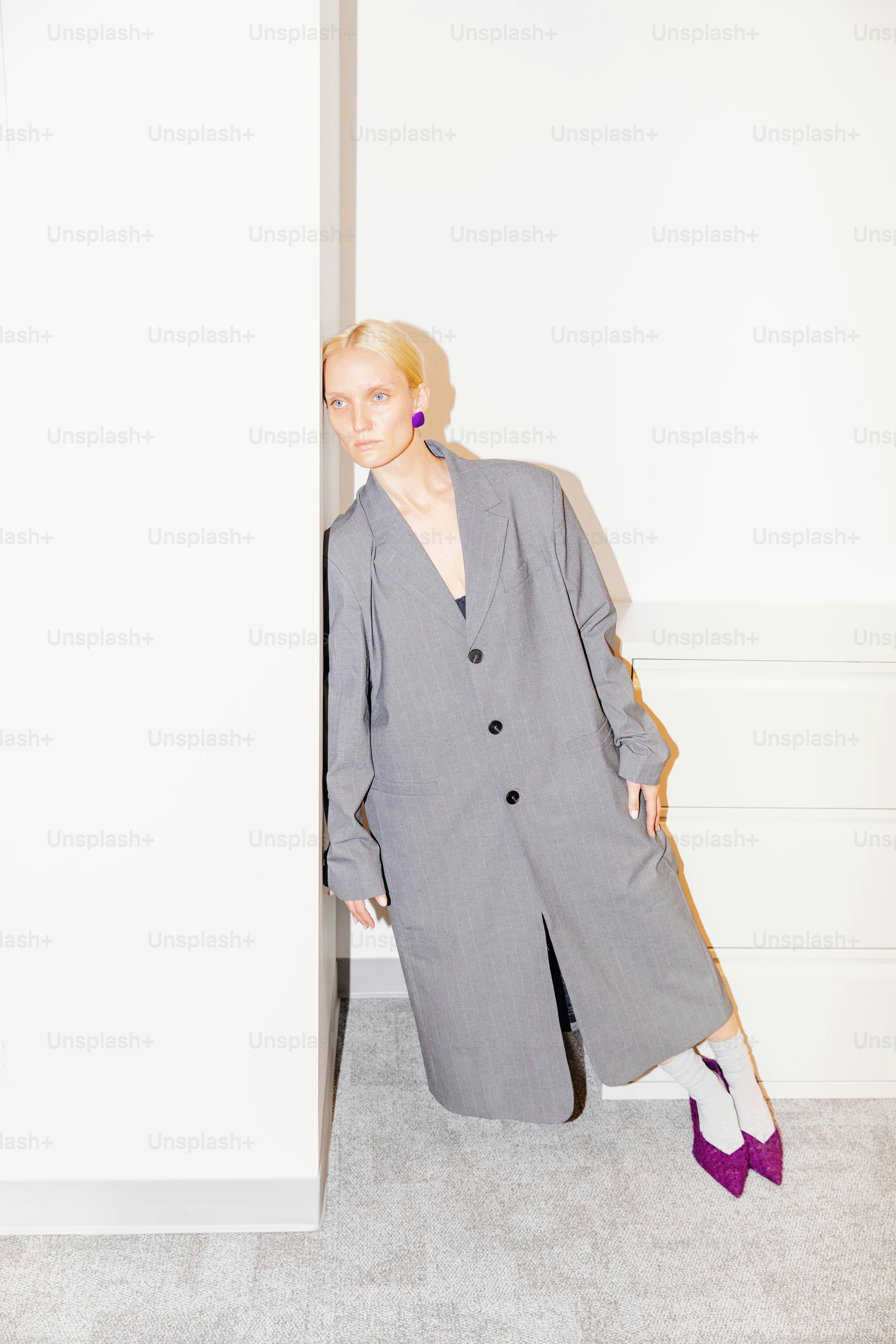 A woman sitting at a desk in front of a computer photo – Team Image on ...