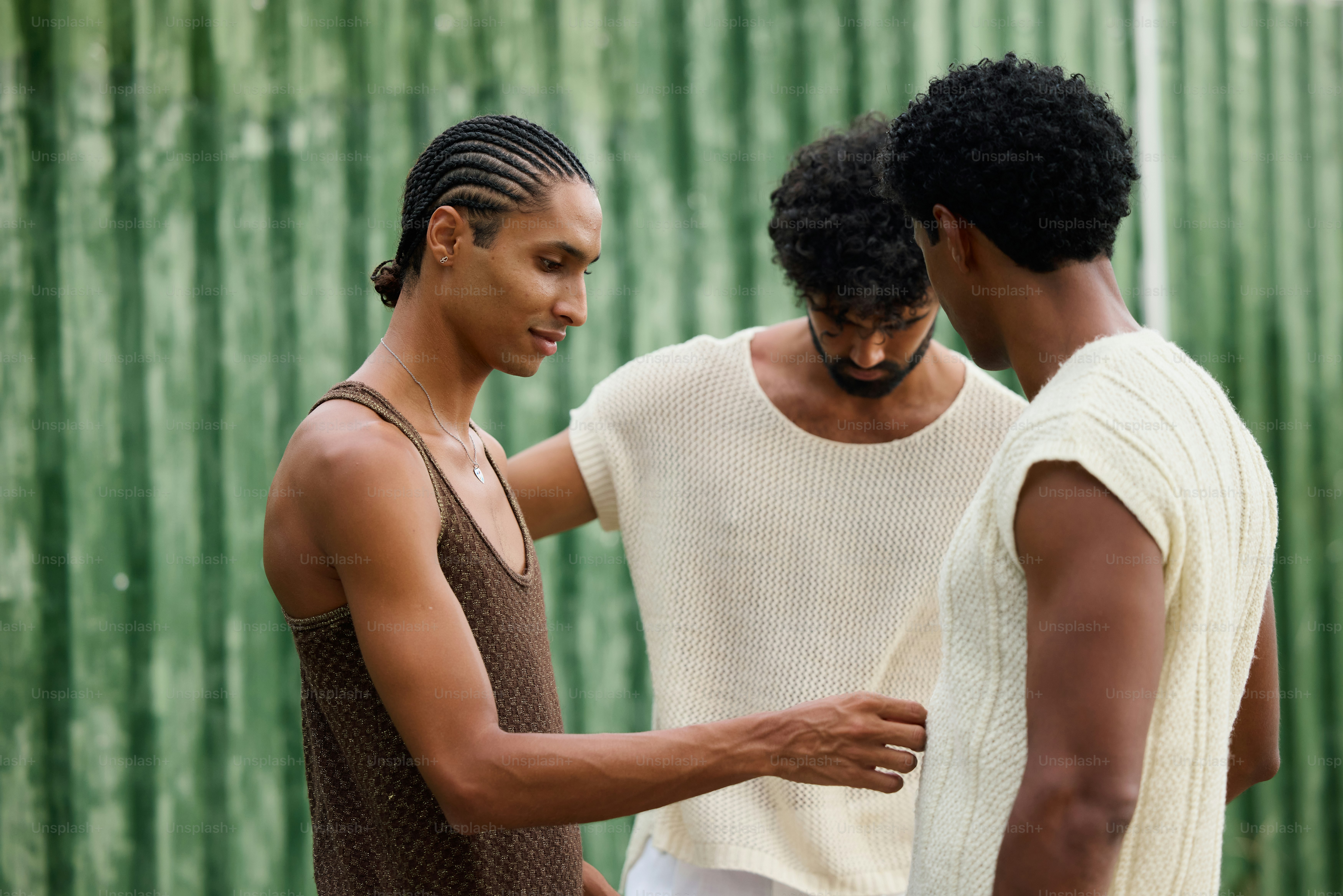 A group of three men standing next to each other photo – Friendship ...