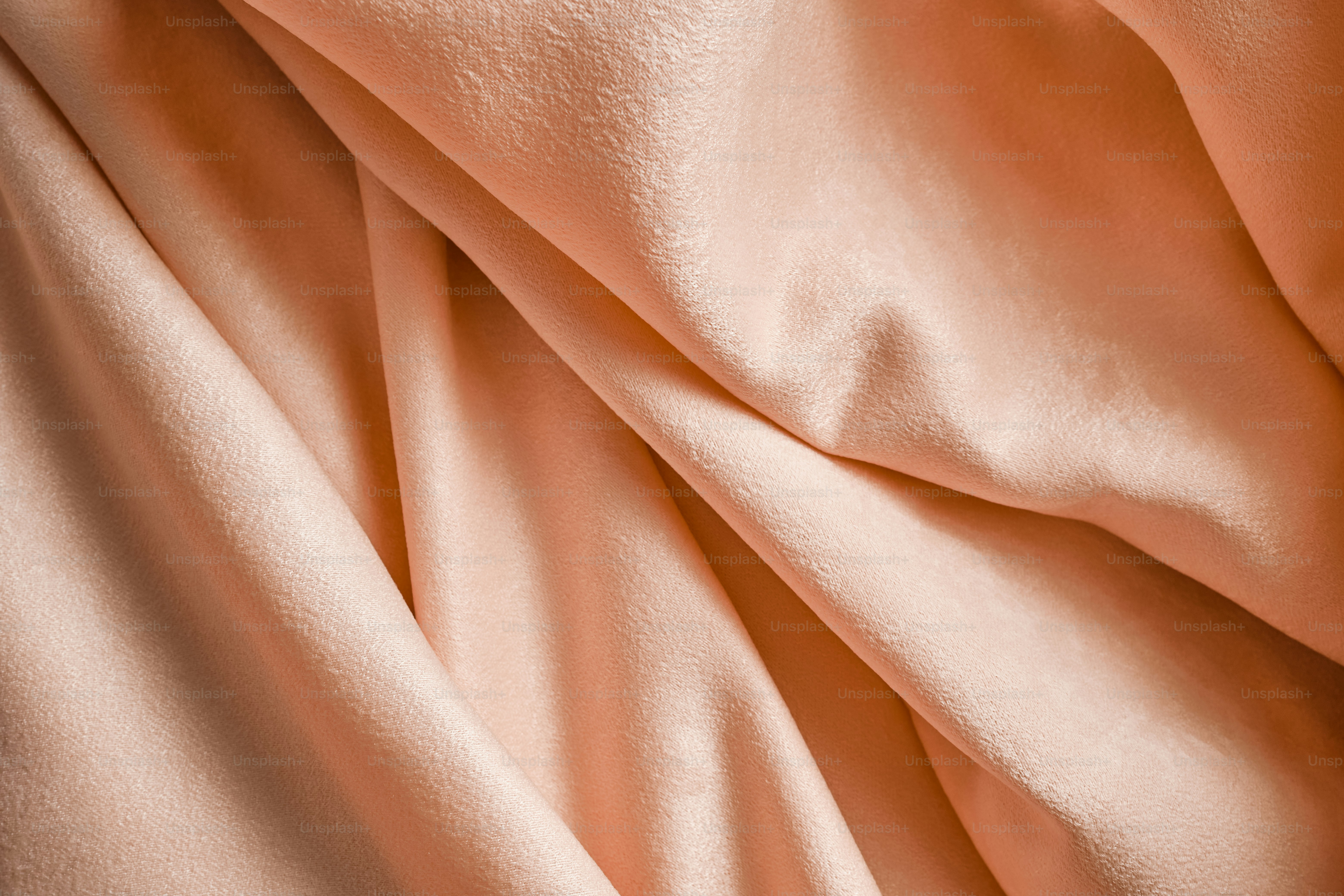 A close up of a peach colored fabric photo – Peach fuzz Image on Unsplash