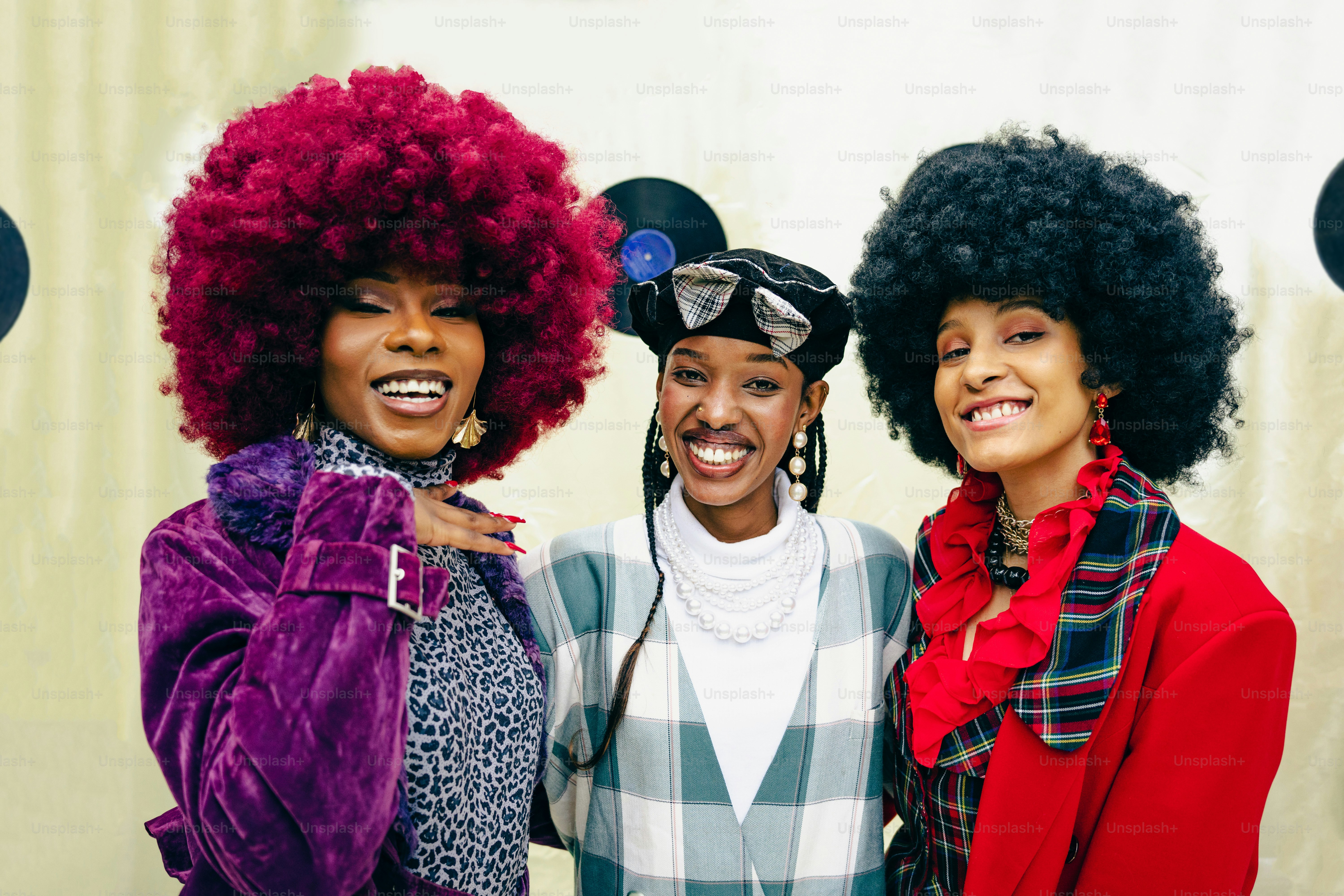 A group of three women standing next to each other photo – Happy Image ...