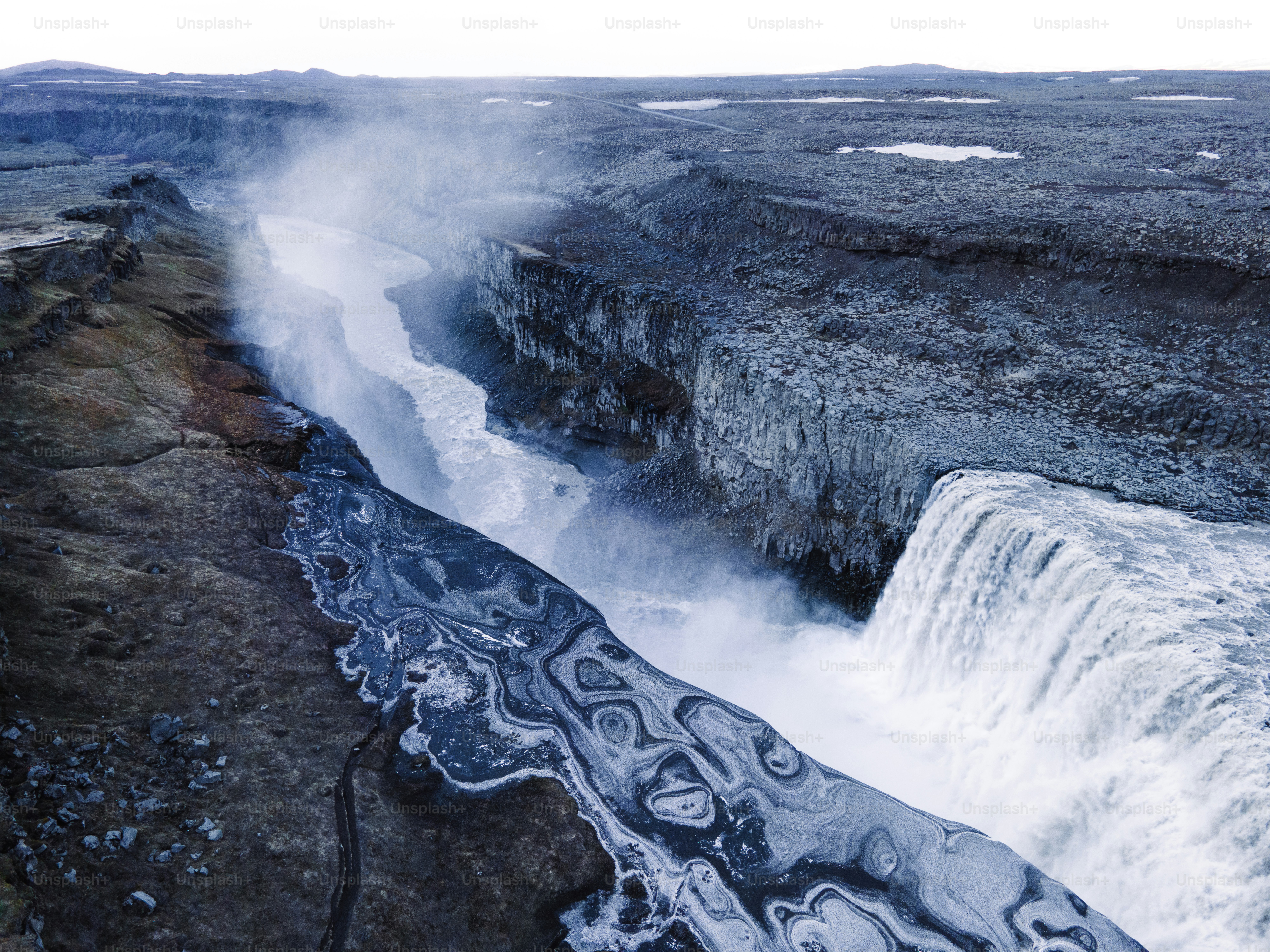 A large waterfall with a river running through it photo – Nature Image ...