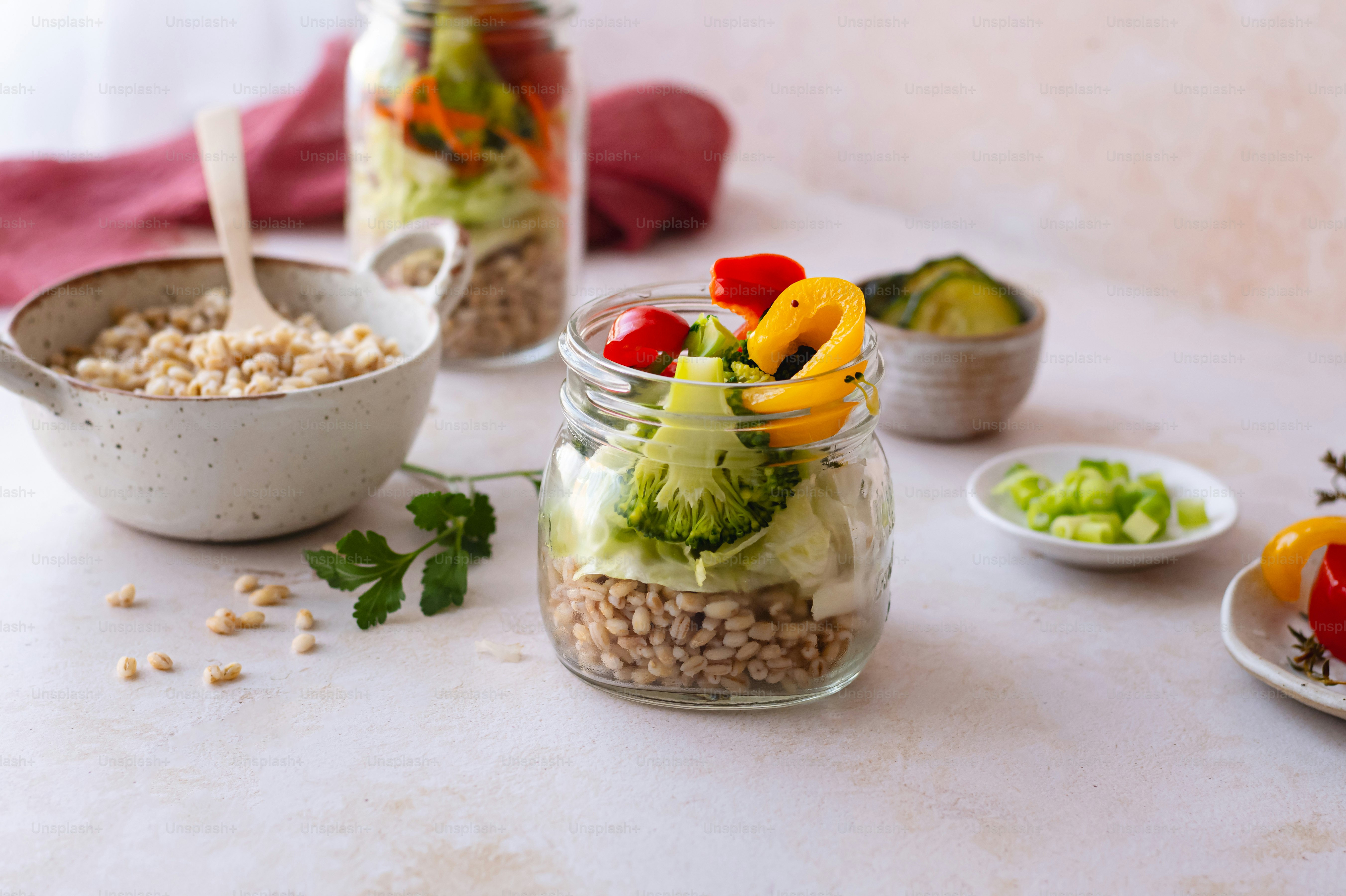 A table topped with bowls of food and bowls of vegetables photo ...