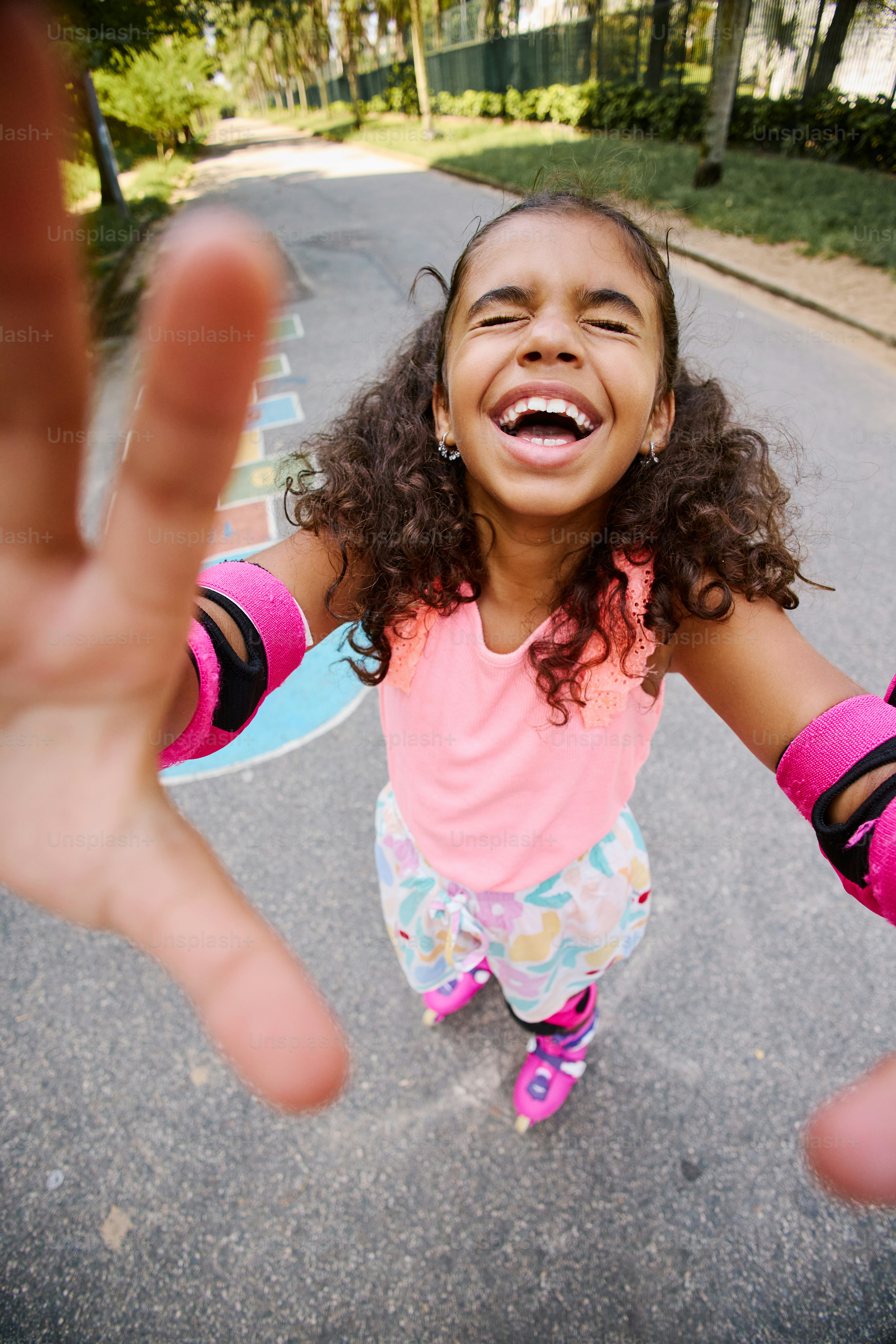 A little girl standing in the middle of a street photo – Tween Image on ...