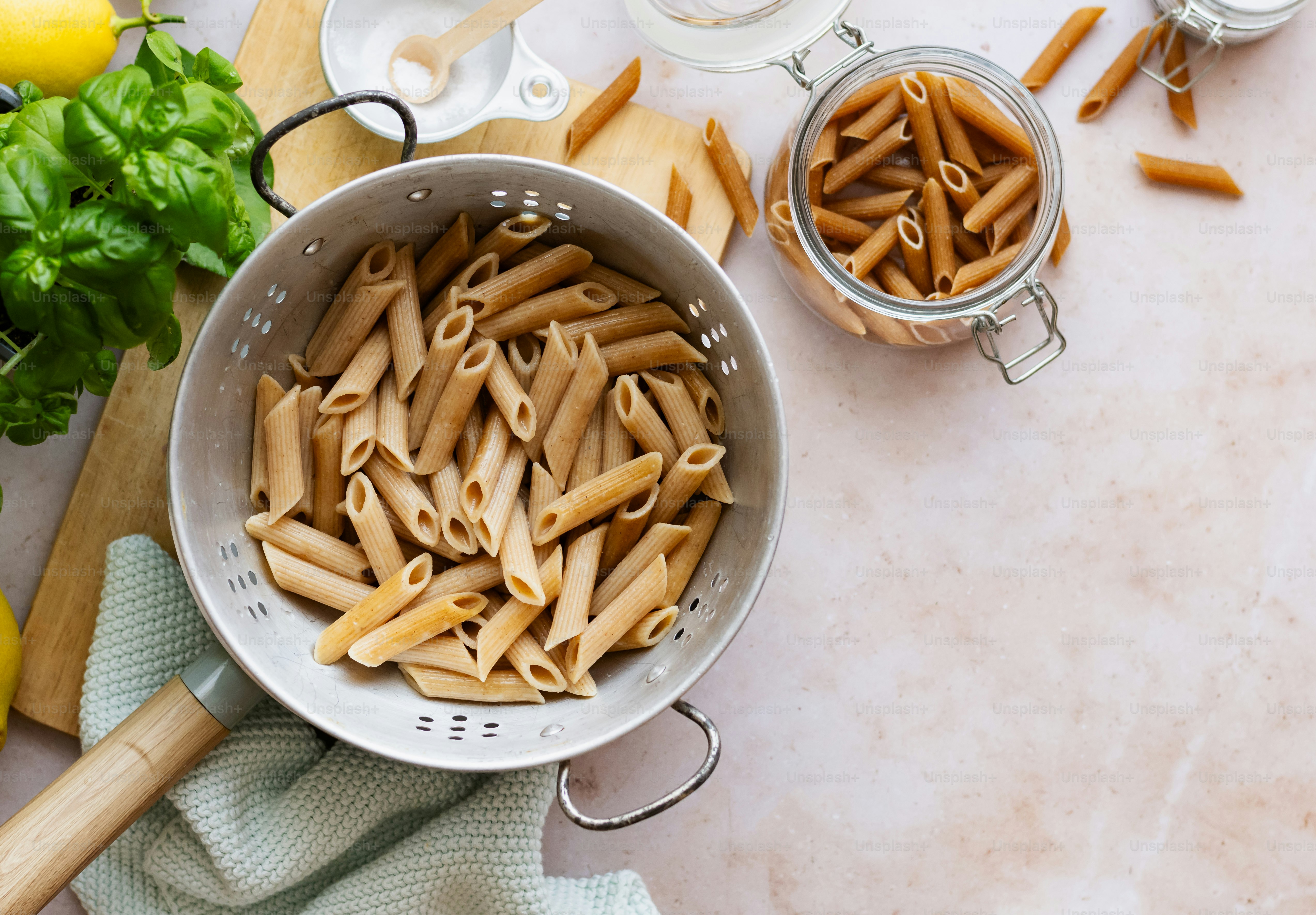 A pan filled with pasta sitting on top of a counter photo – Healthy ...
