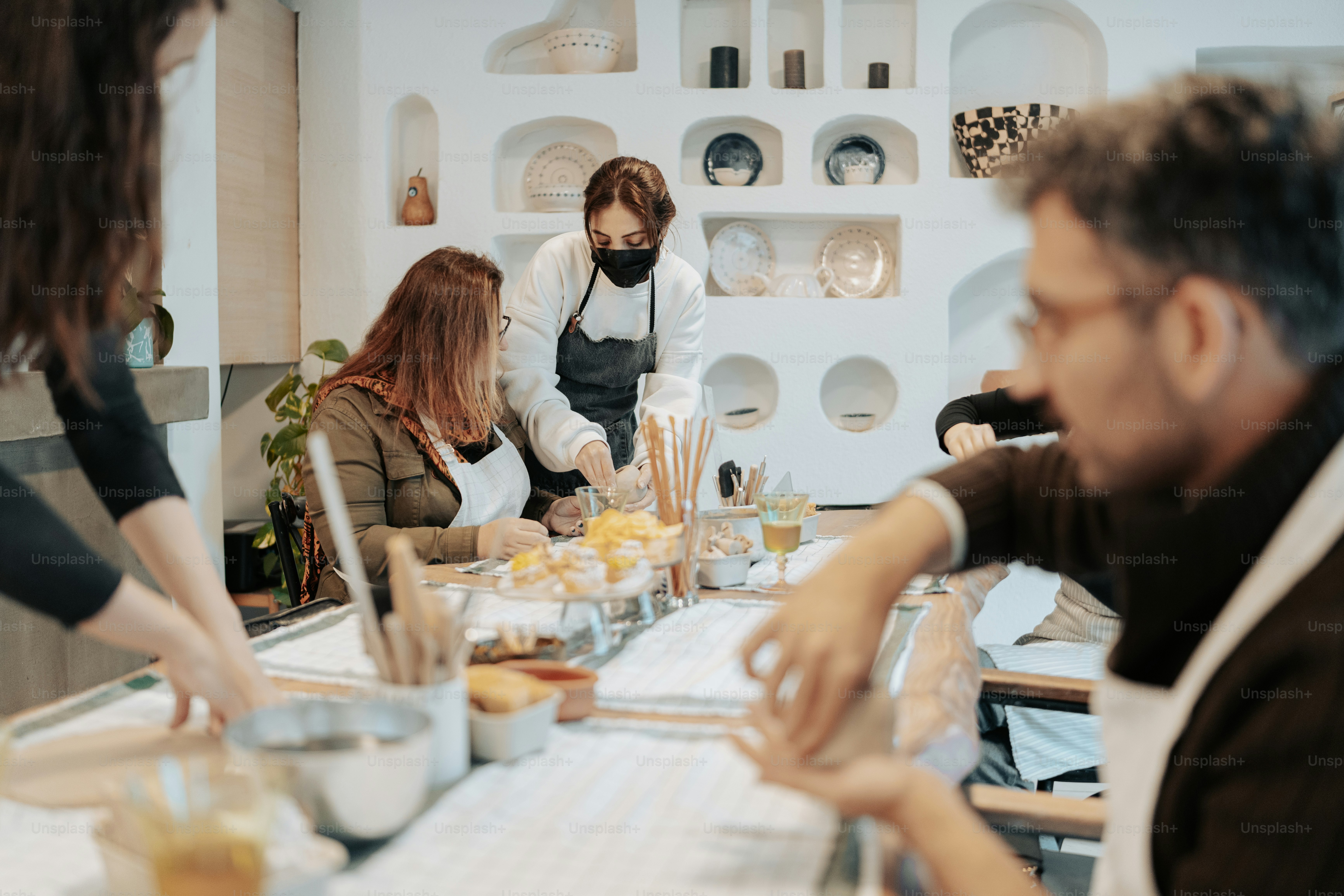 A group of people in a kitchen preparing food photo – Community Image ...