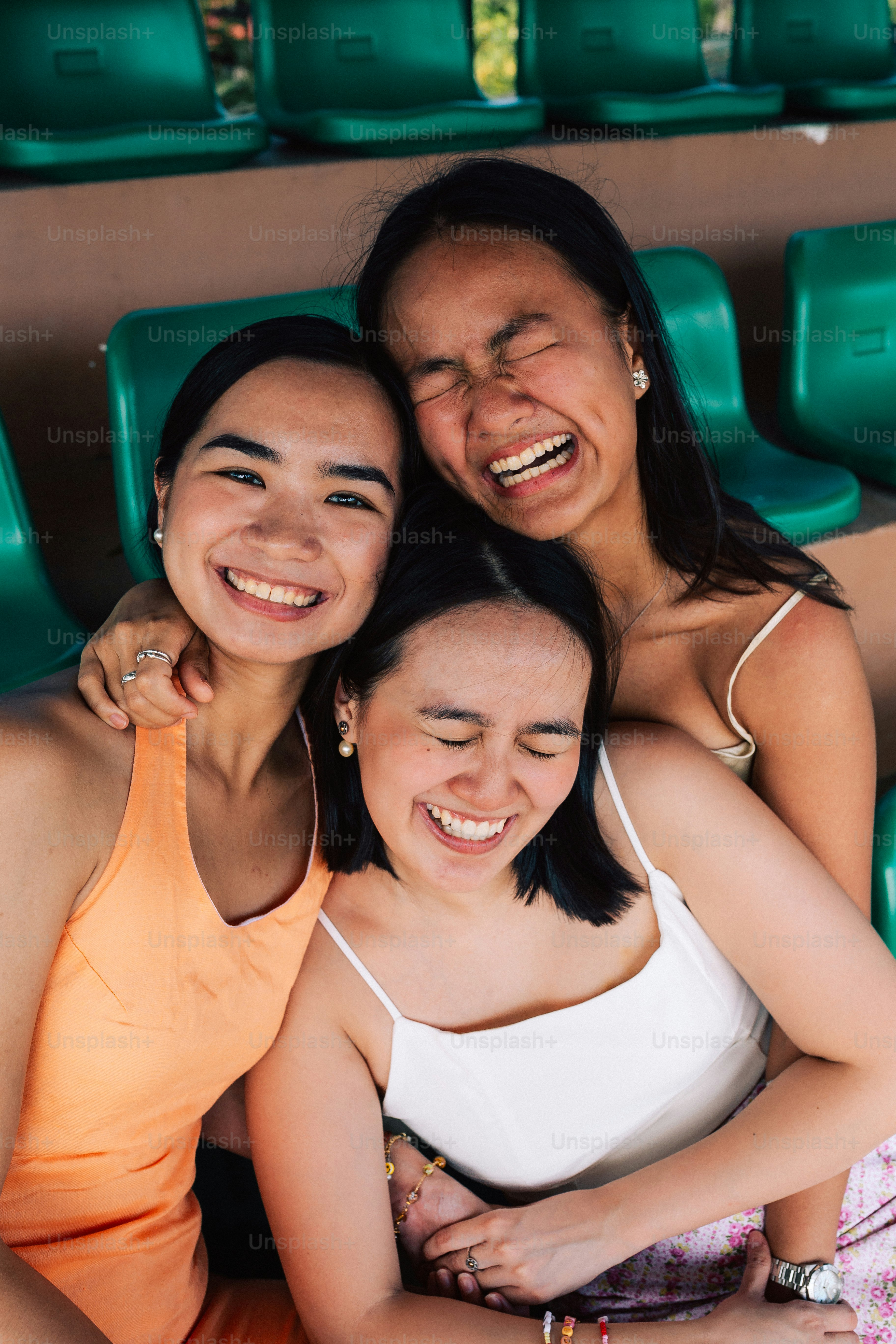 A group of women running across a grass covered field photo – Happy ...