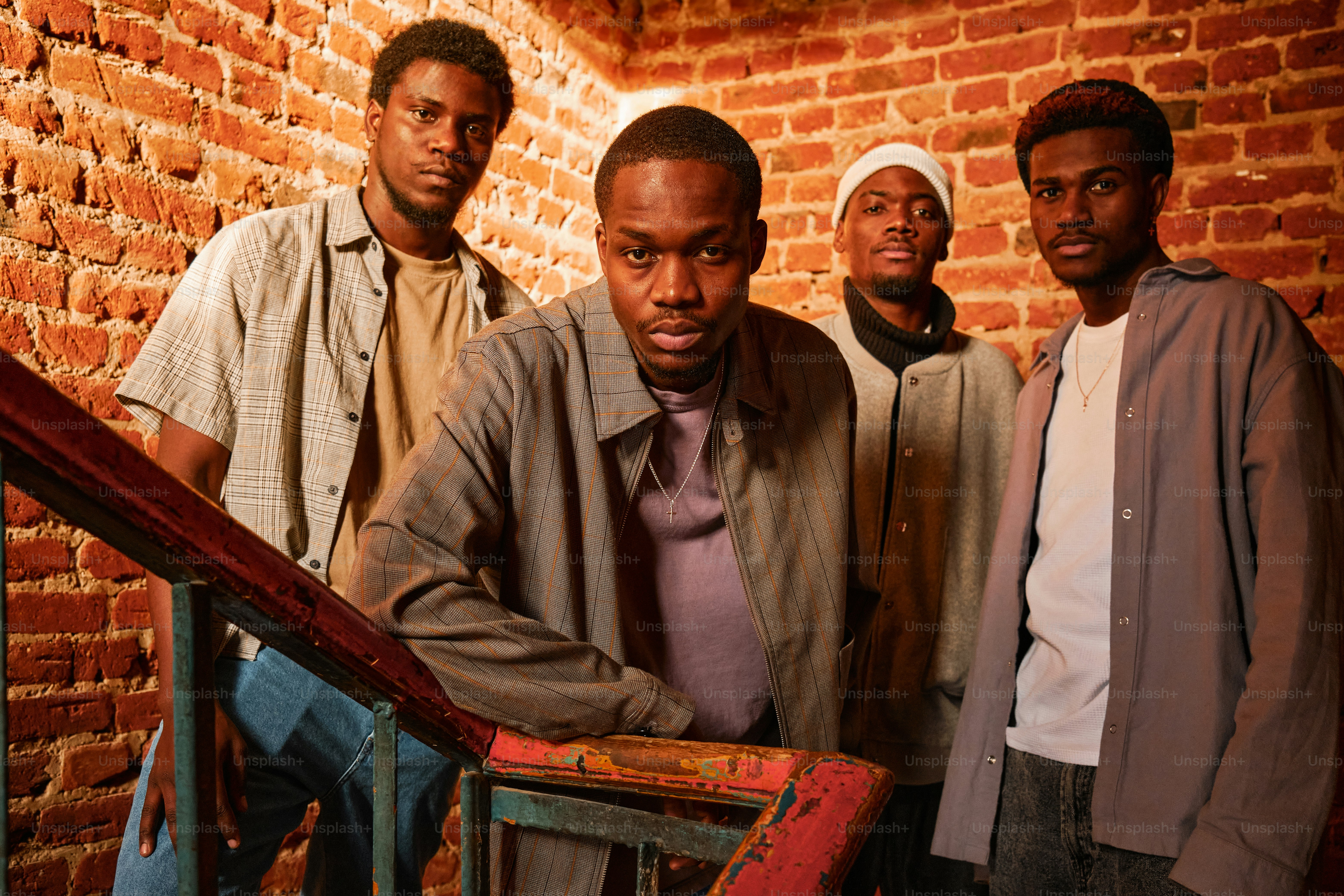 A group of men standing next to each other photo – Group of men Image ...