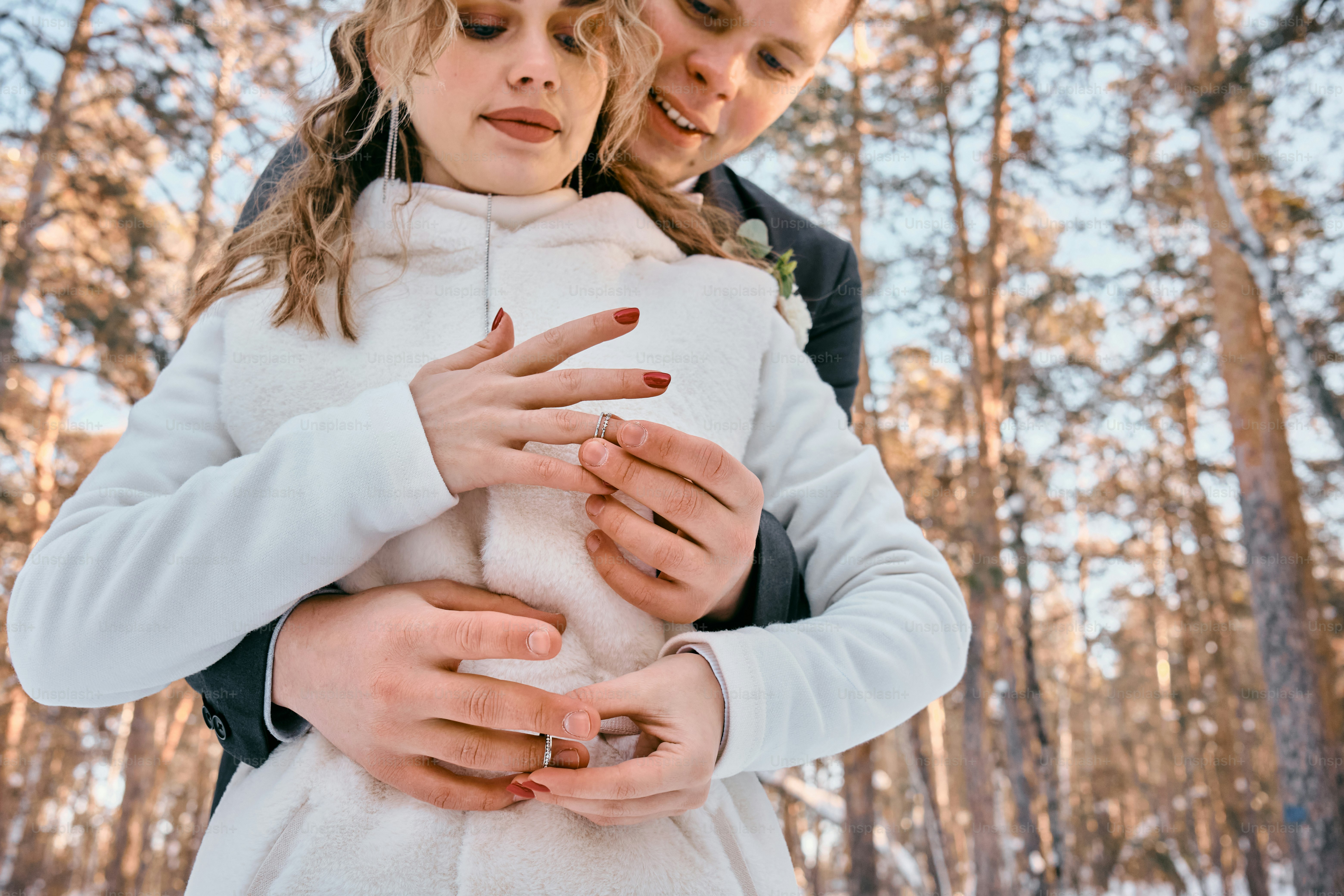 A couple of people that are standing in the snow photo – Bride Image on ...