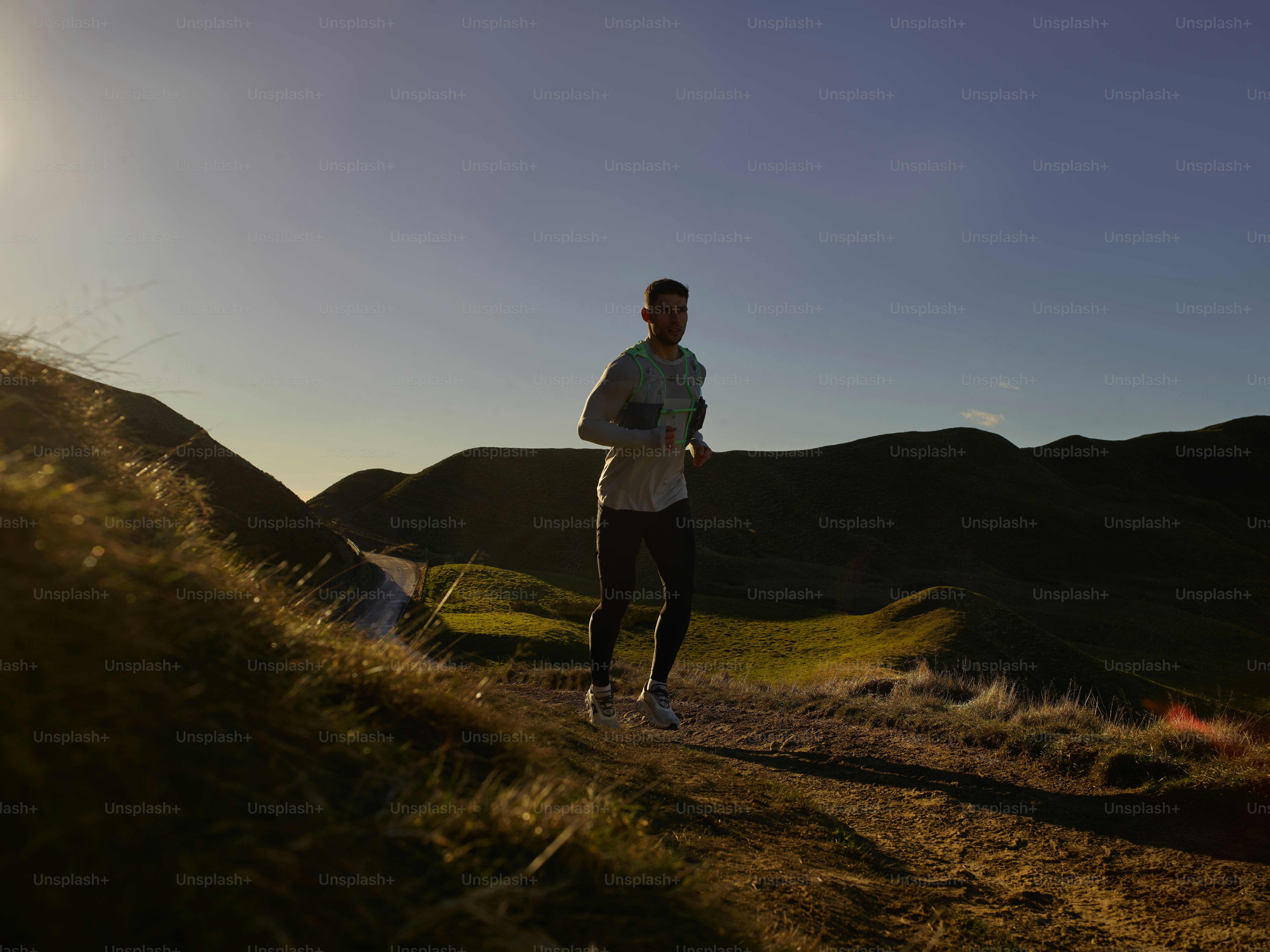 A man running on a trail in the mountains photo – Peak district uk ...