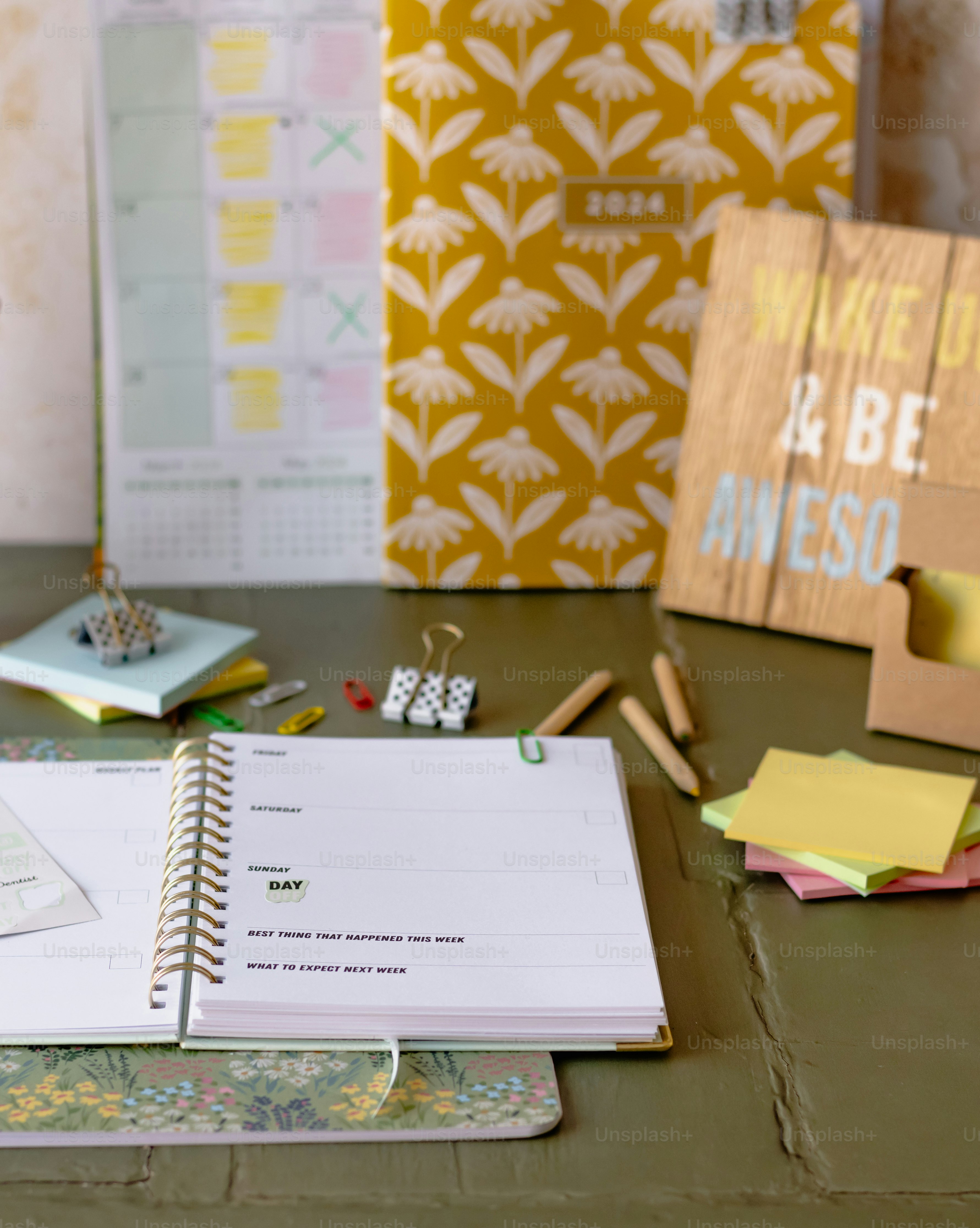 A table topped with lots of notebooks and papers photo – Schedule Image ...