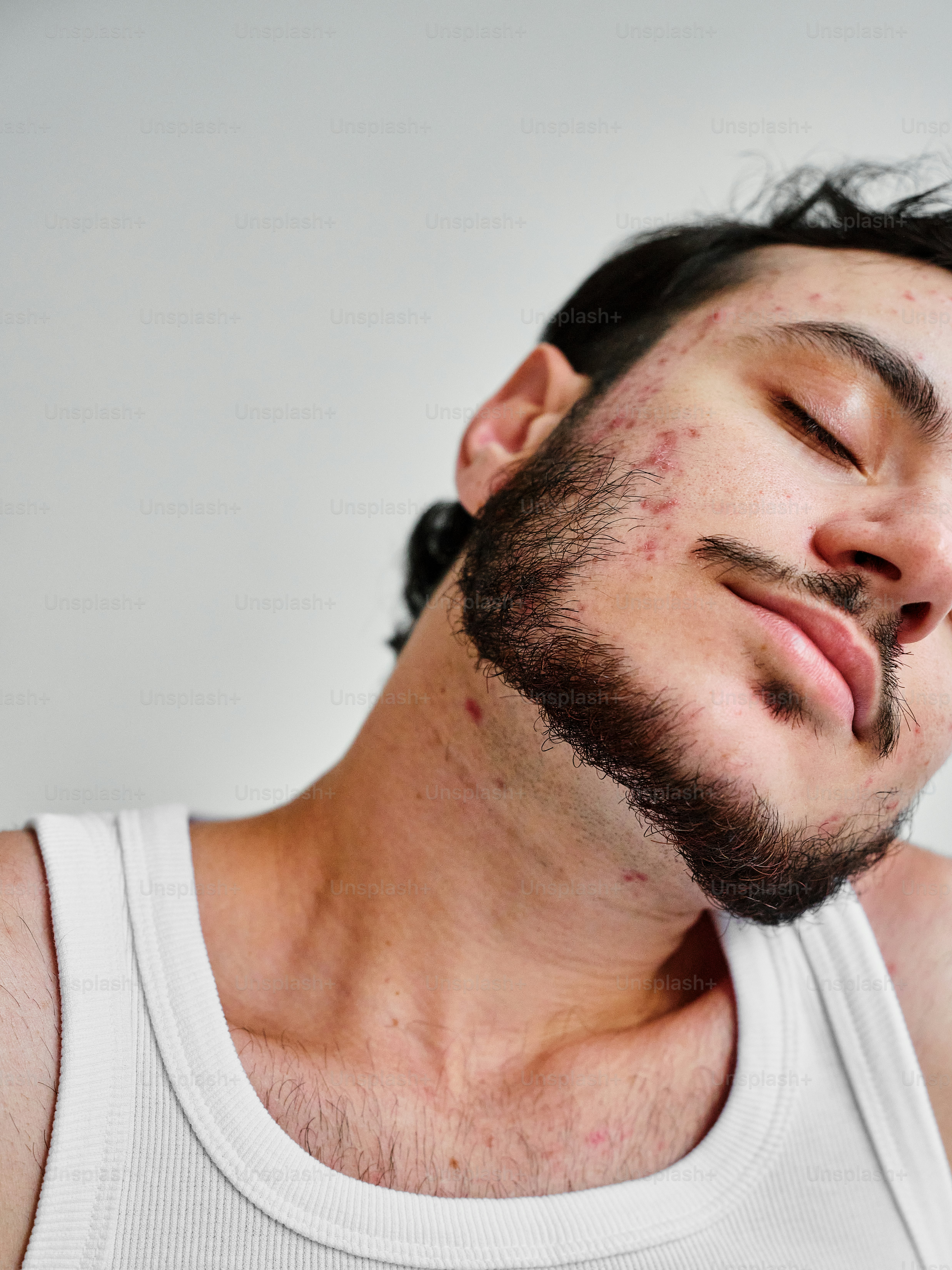 A man with a goatee and a mustache posing for a picture photo ...