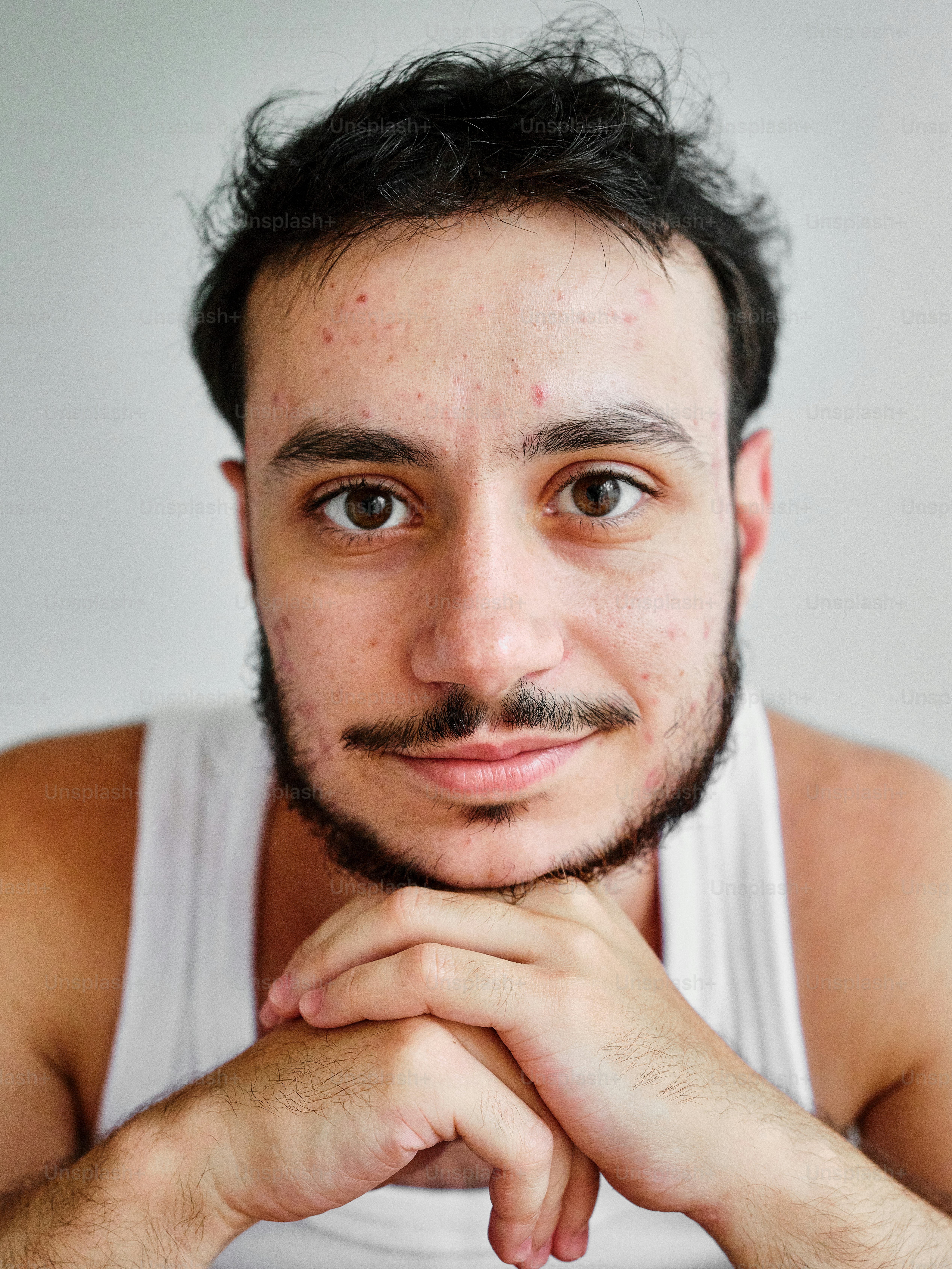 A man with a goatee and a mustache posing for a picture photo ...
