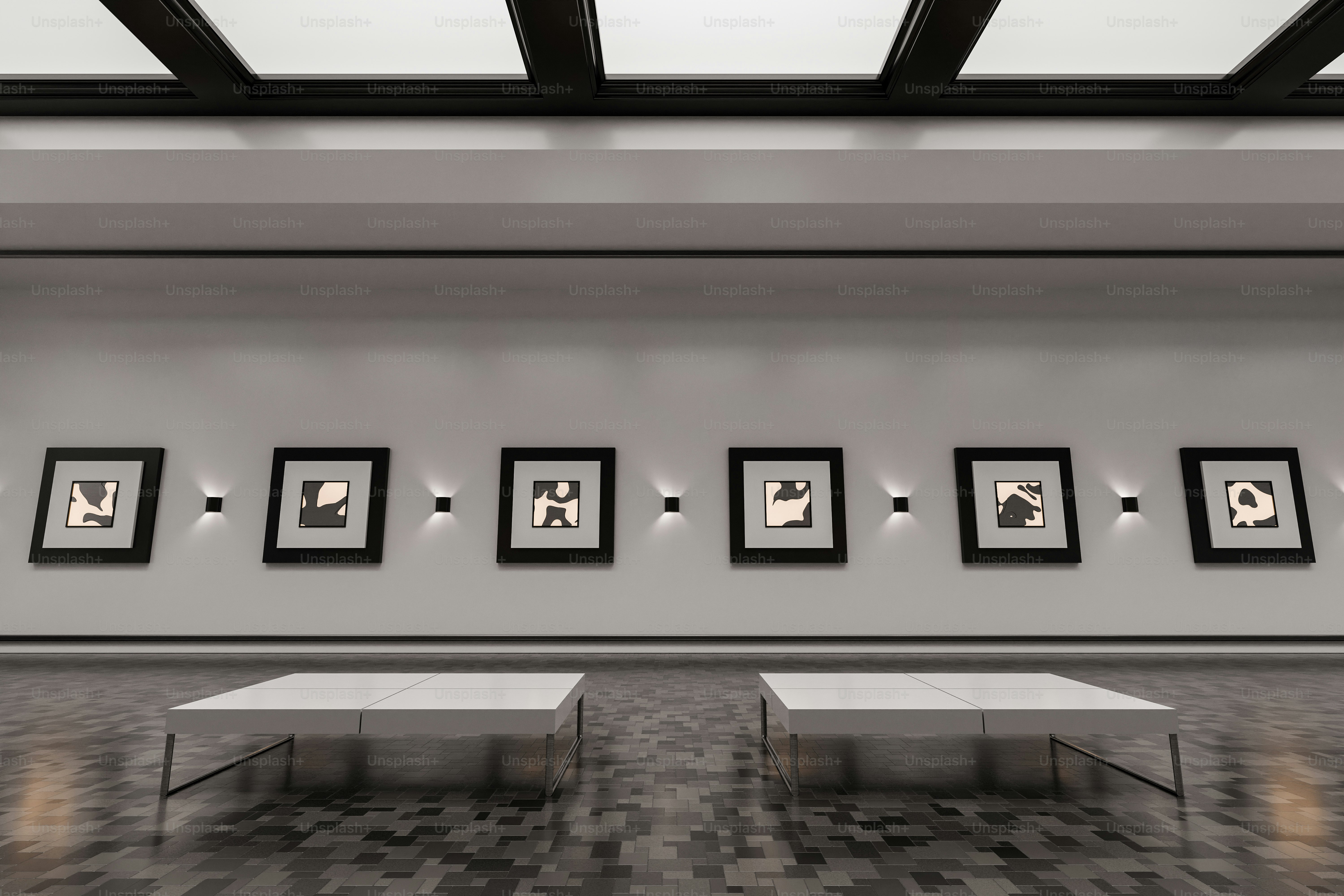 A room filled with lots of black and white artwork photo – Open space ...