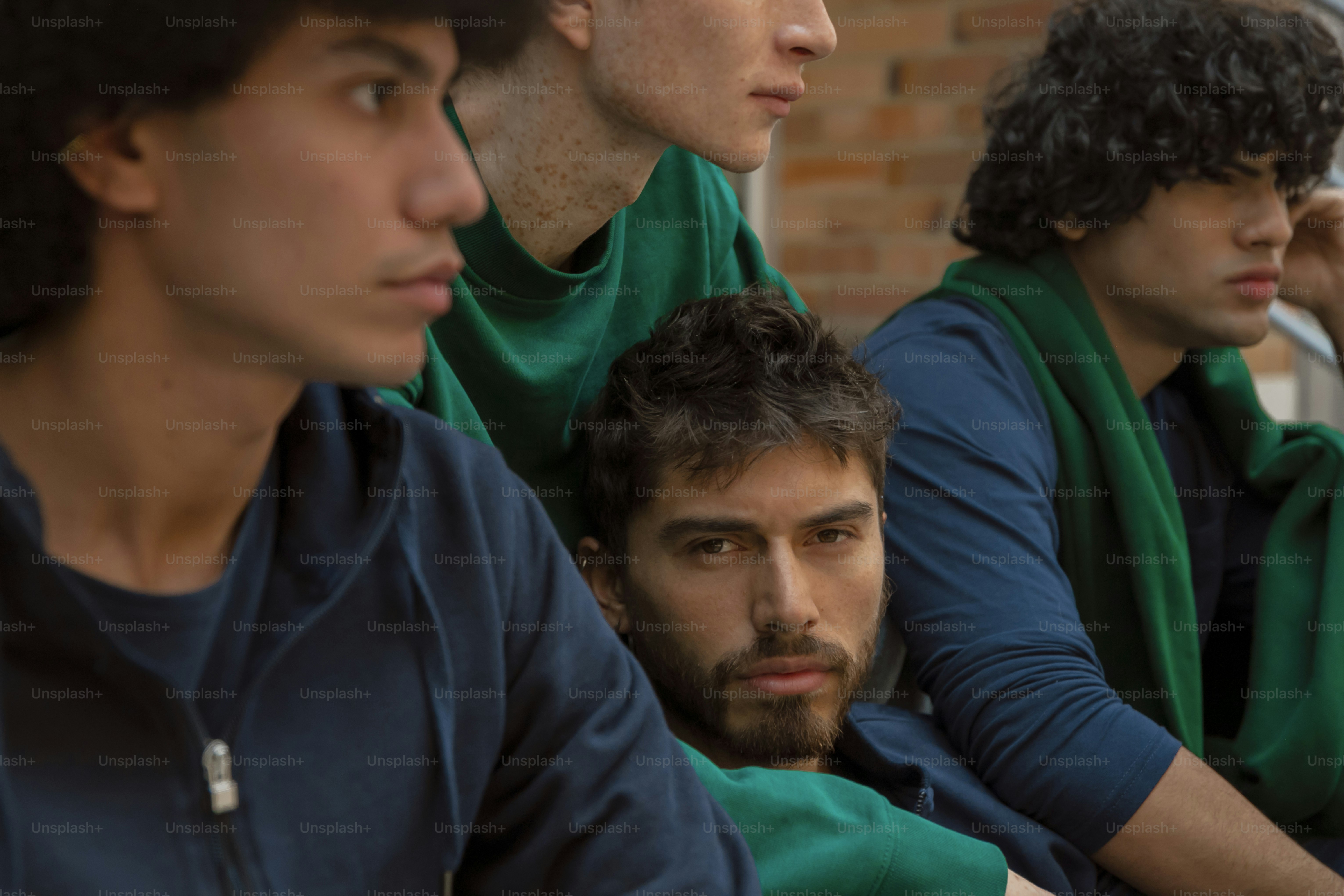 A group of men standing next to each other photo – Hoodie Image on Unsplash