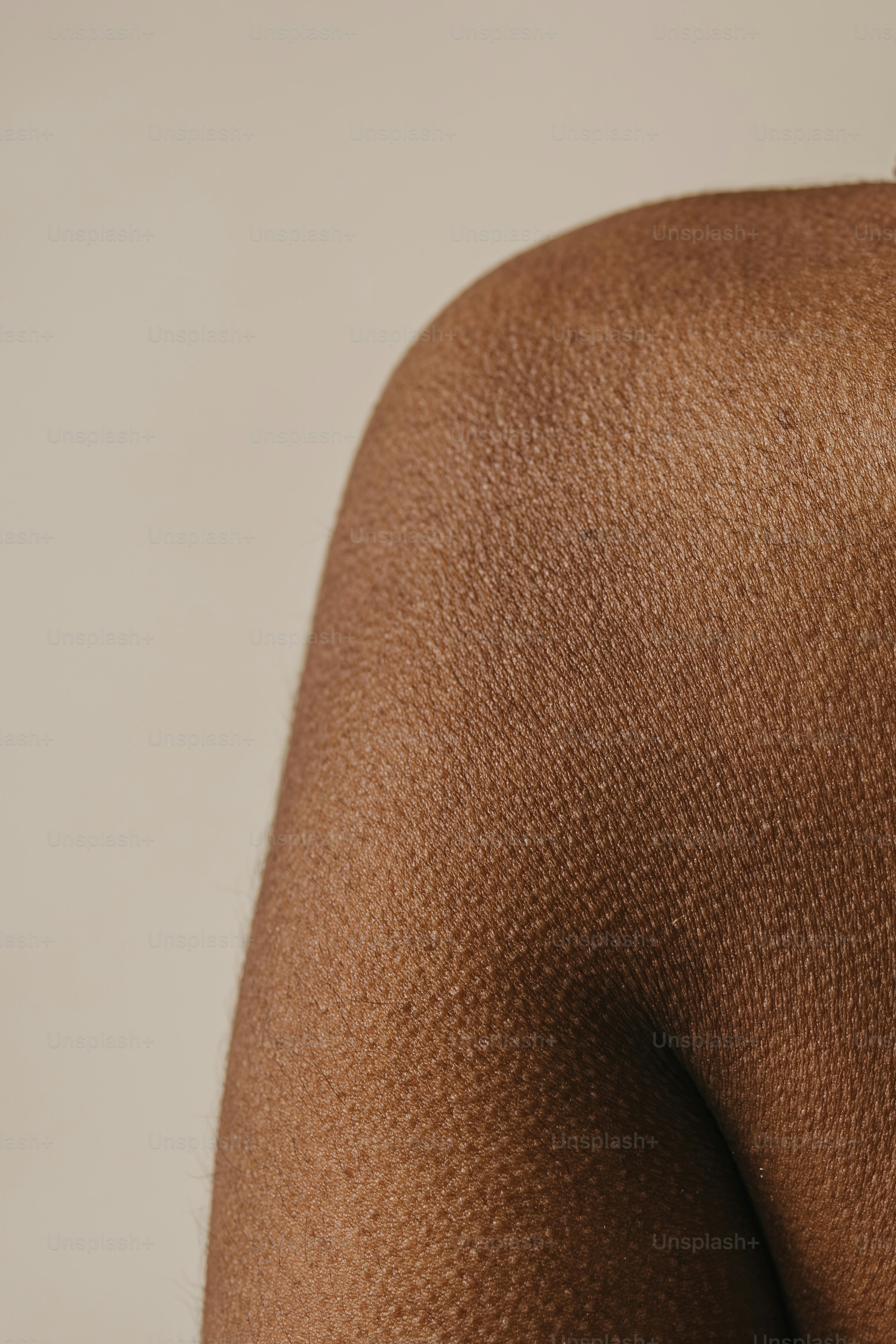 A close up of a person's back with a cell phone photo – Hair care Image ...