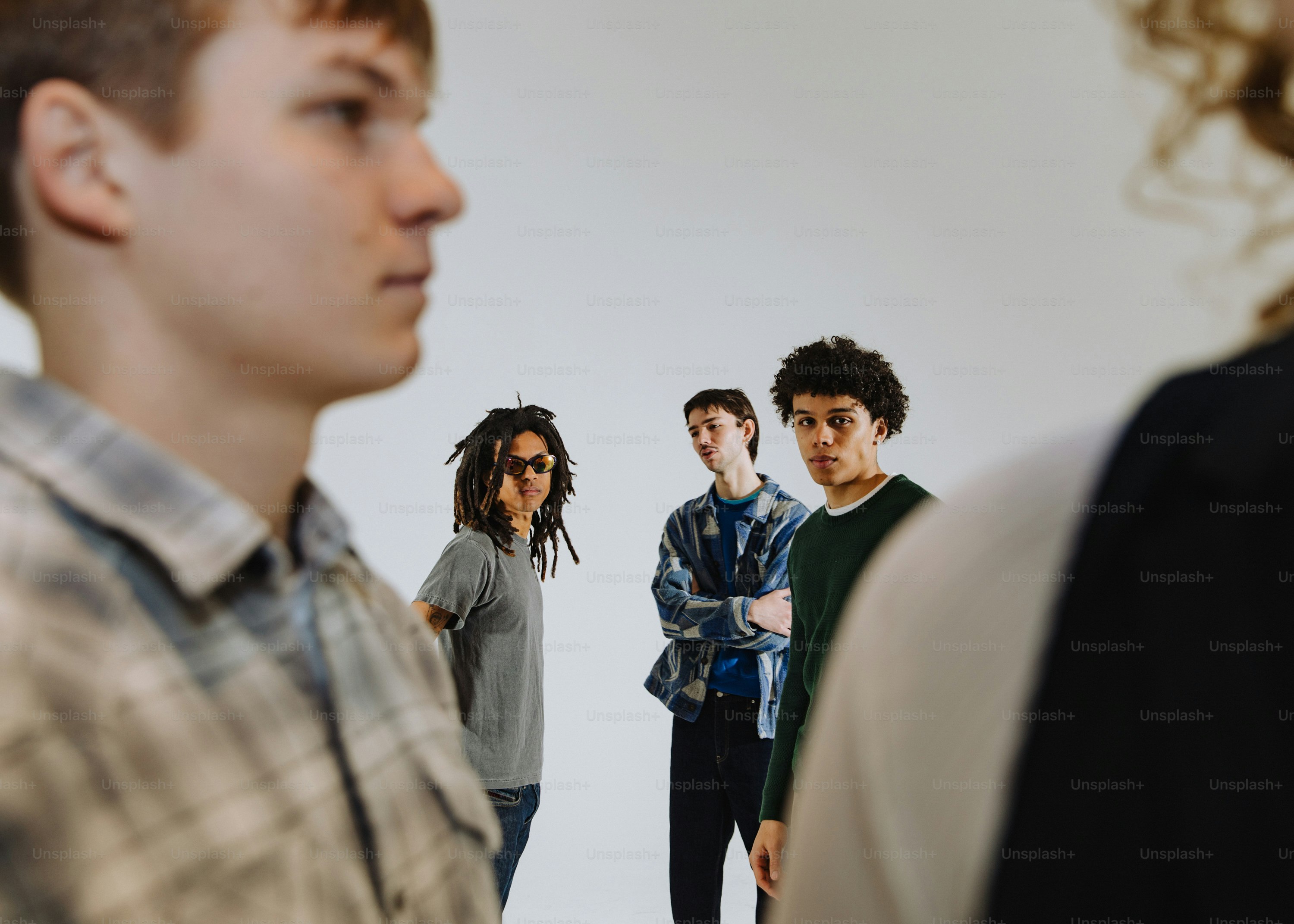 A group of young men standing next to each other photo – Friends Image ...
