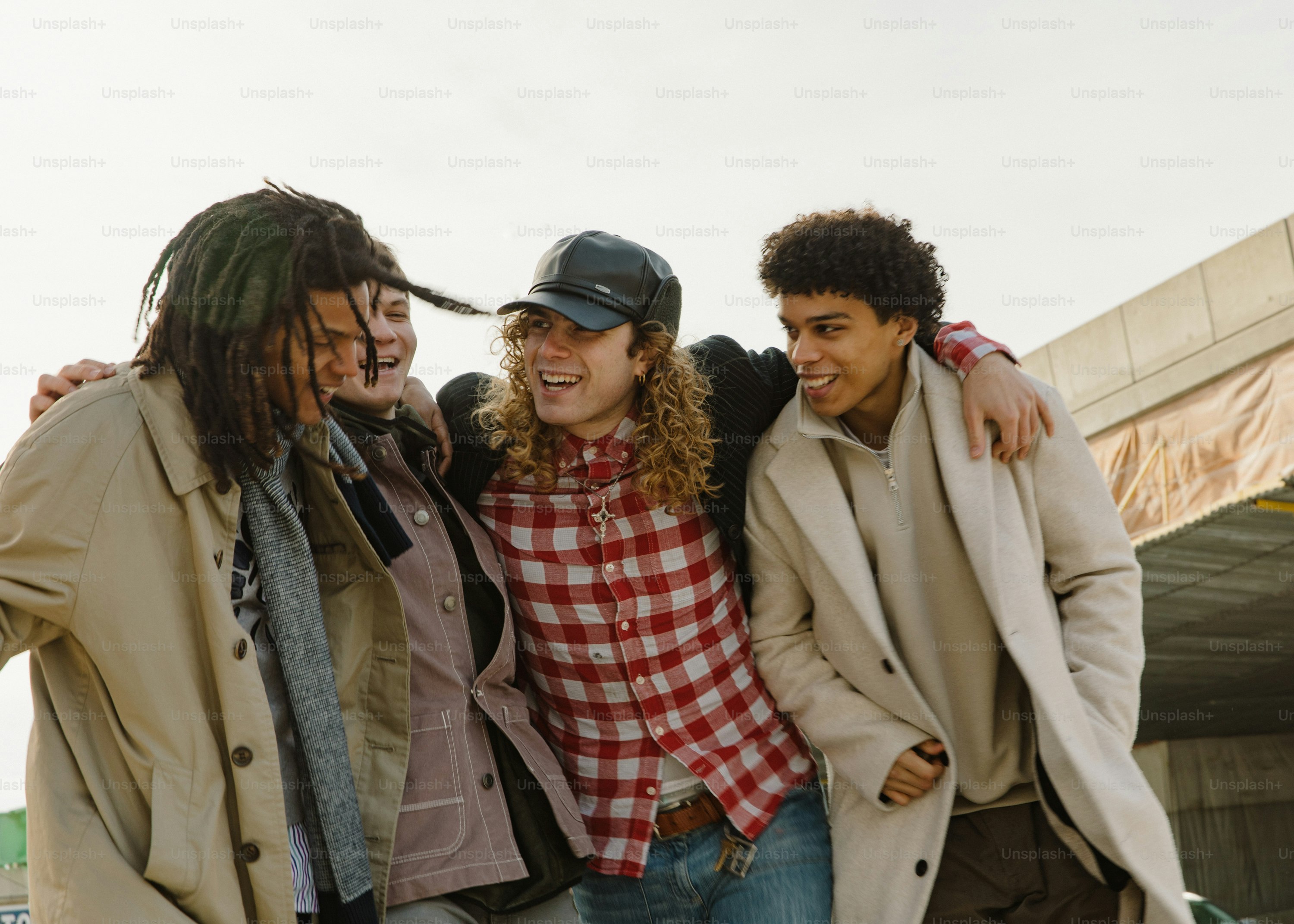 A group of young men standing next to each other photo – Friends Image ...