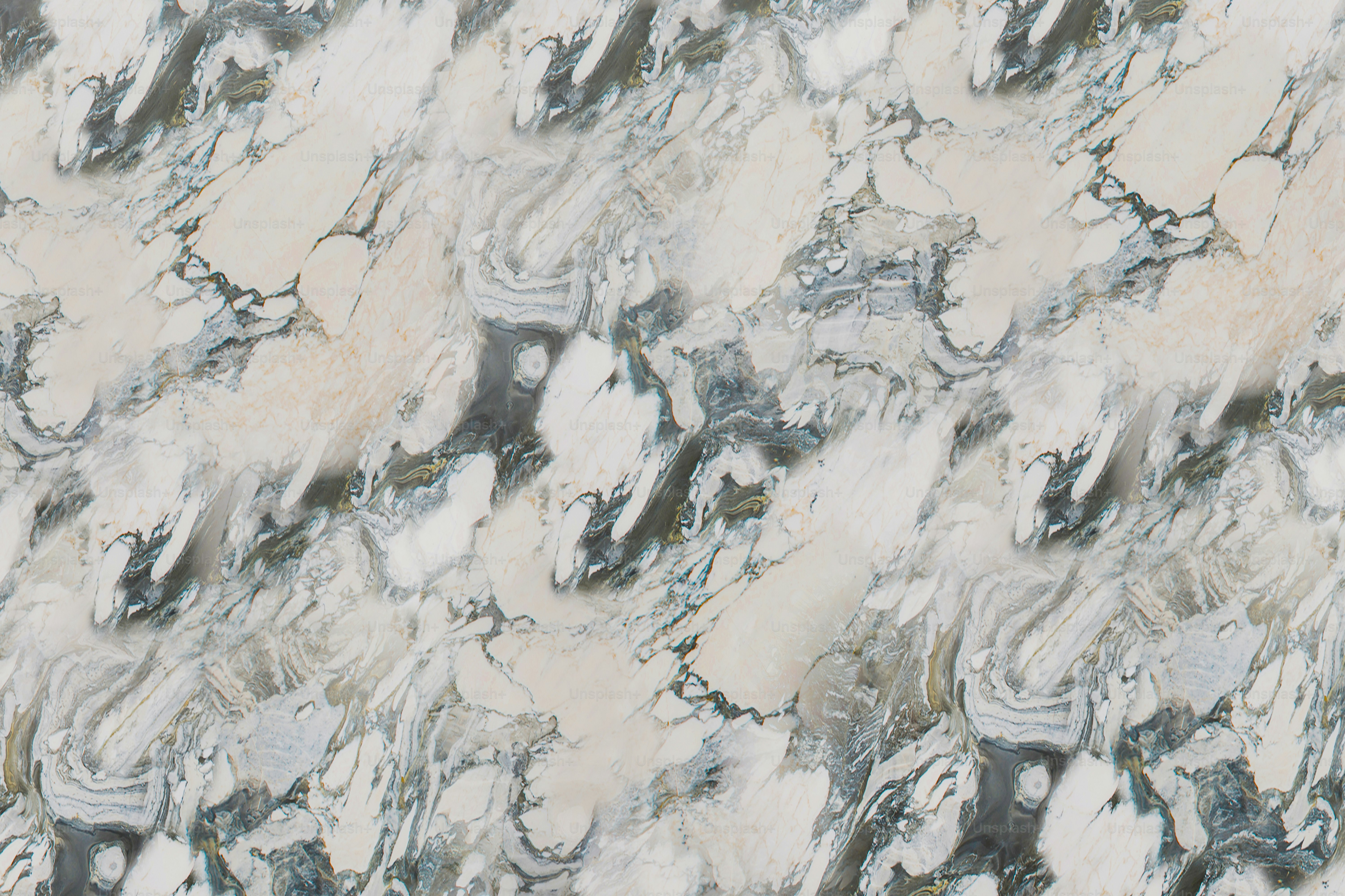 A close up of a marbled surface with brown, blue, and white colors ...