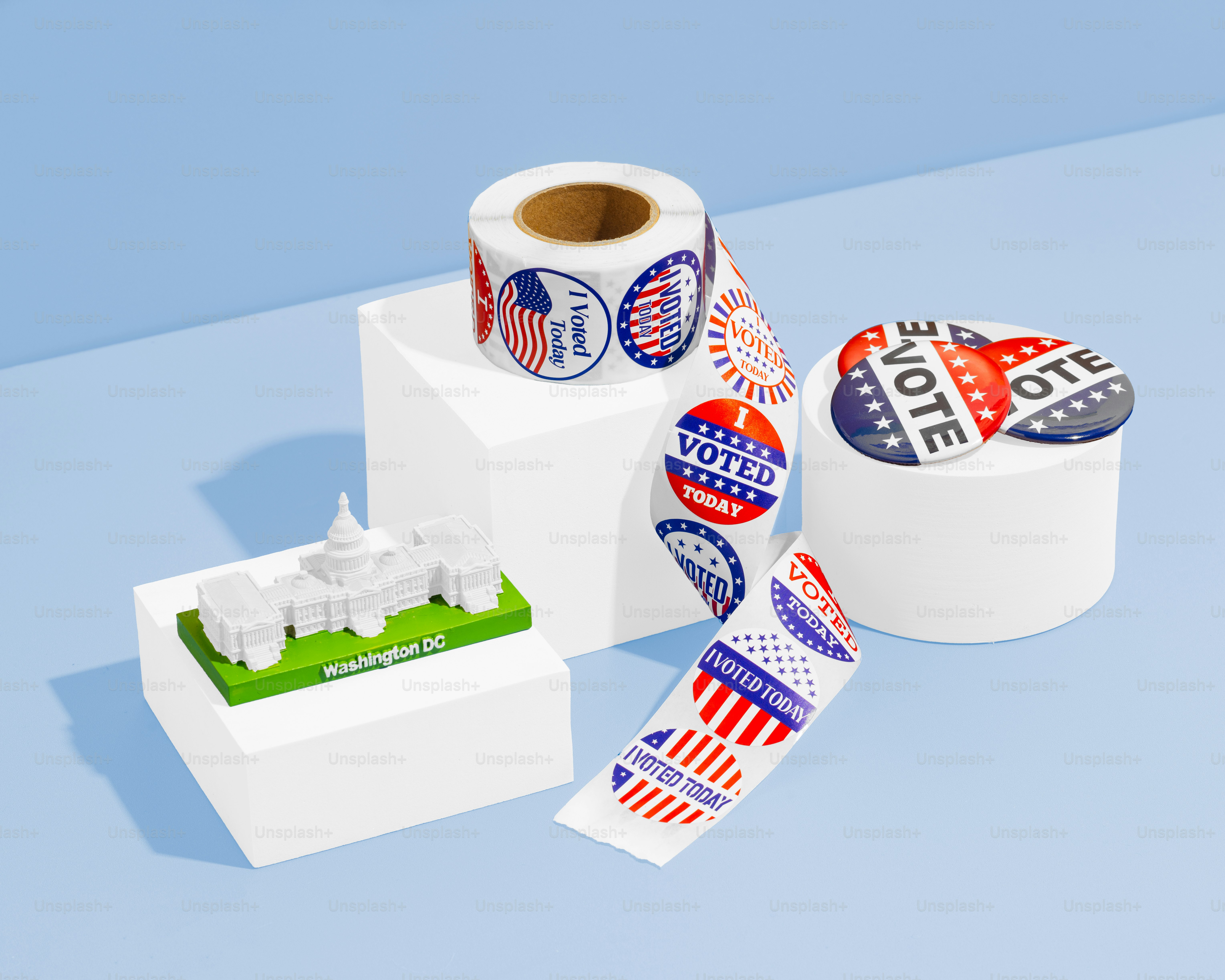 Two rolls of political stickers next to a cup of coffee photo ...