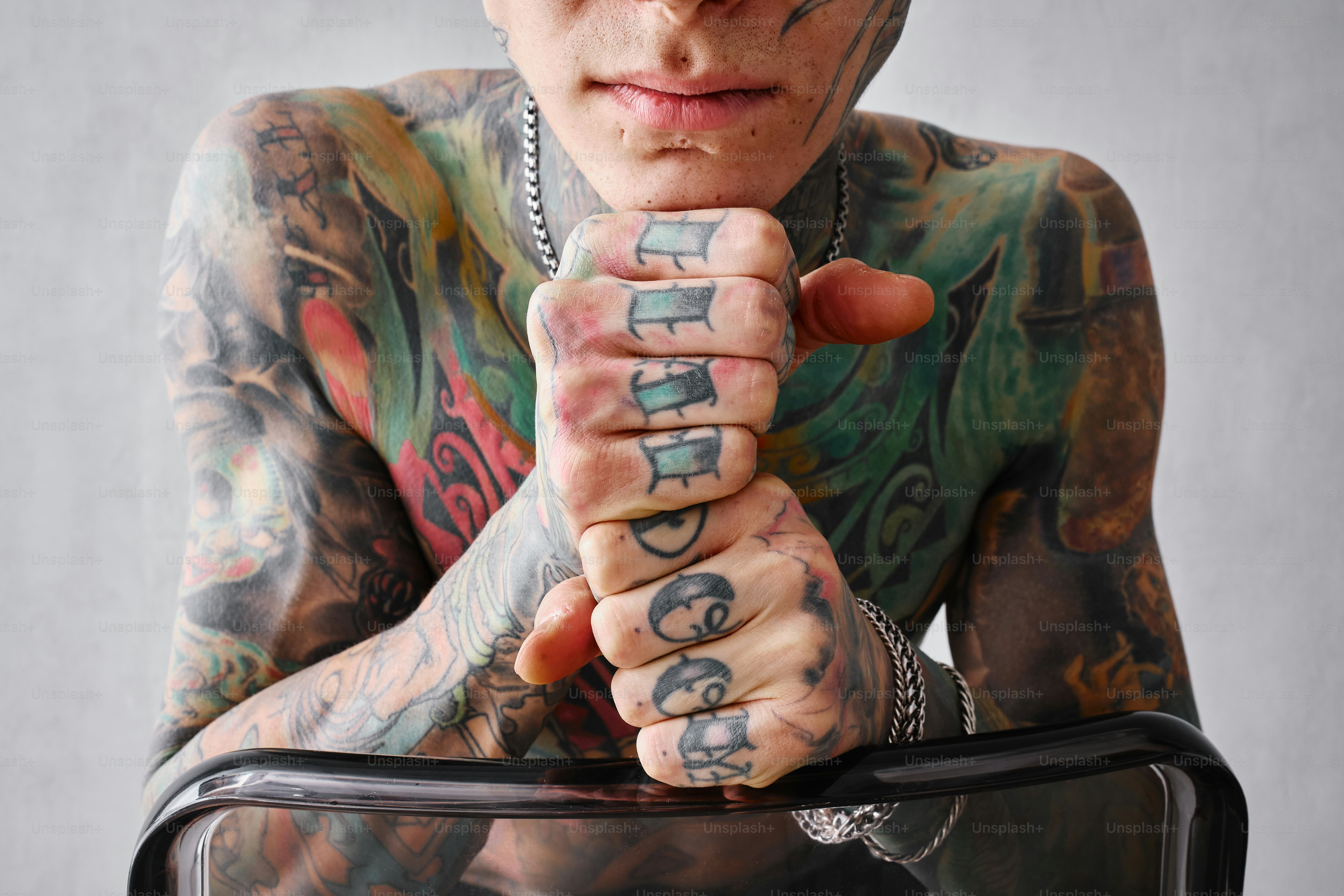A man with a lot of tattoos on his body photo – Tattoos Image on Unsplash