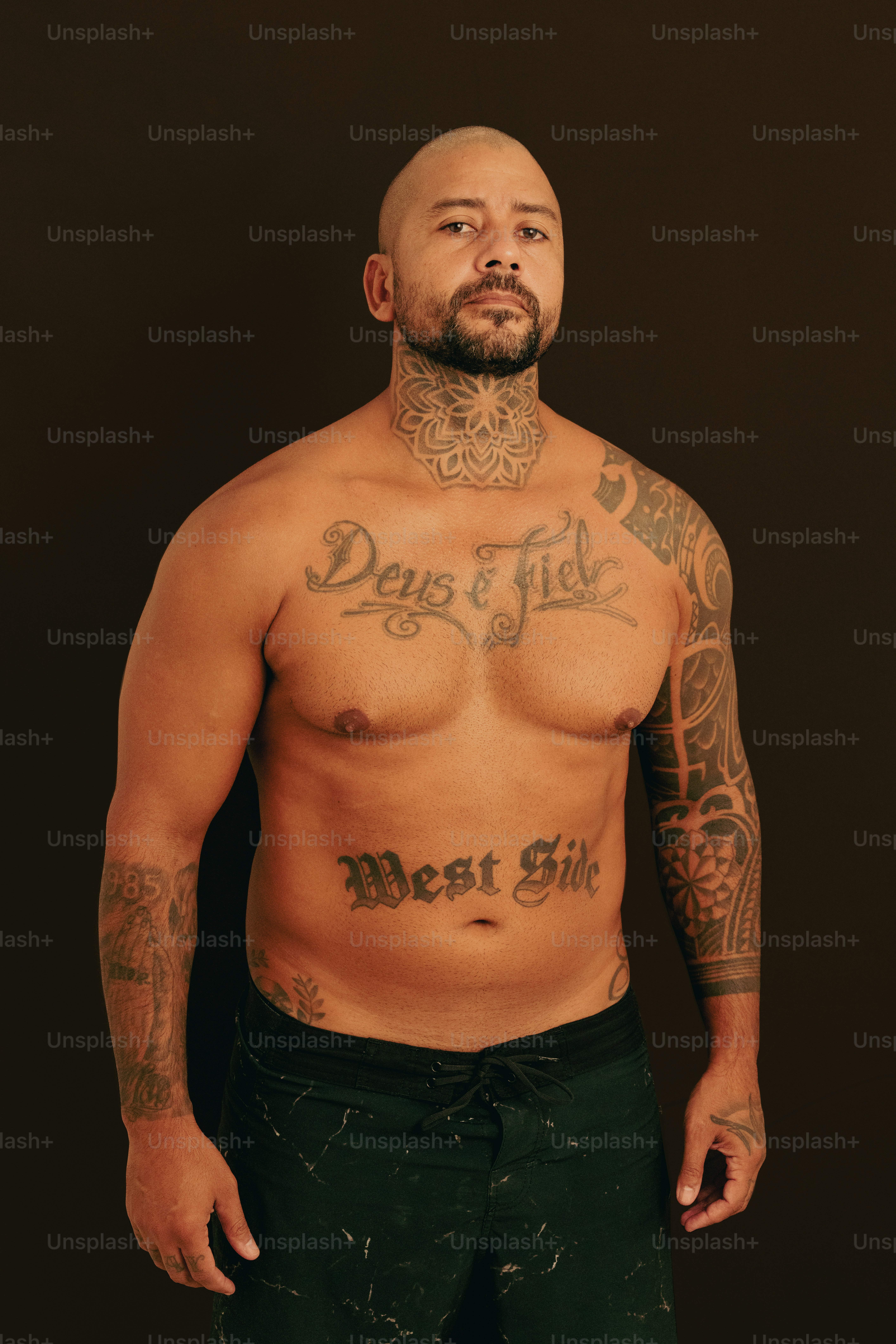 A man with a tattooed arm pointing at the camera photo – Tattoos Image ...