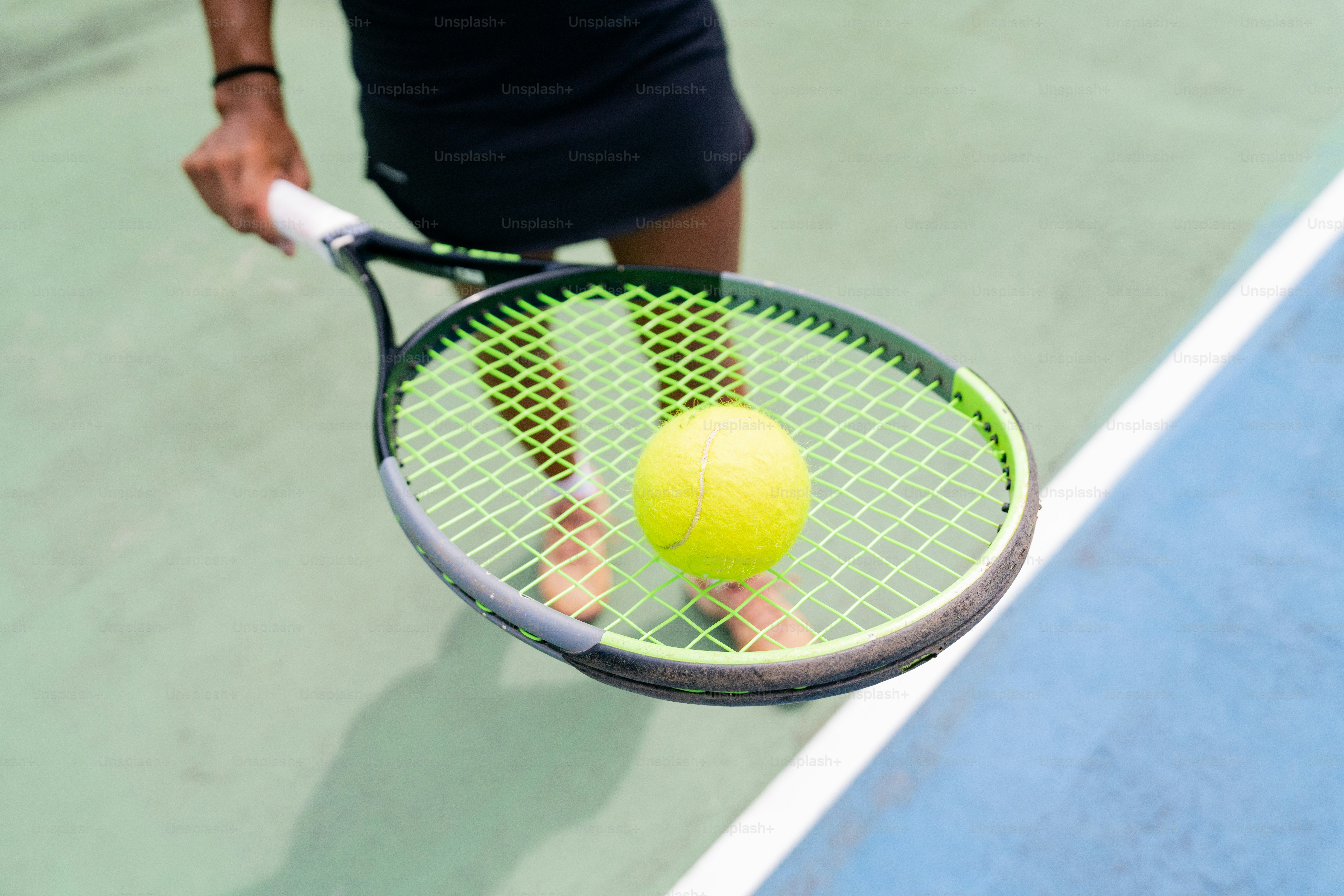A person holding a tennis racket and a tennis ball photo – Tennis ...