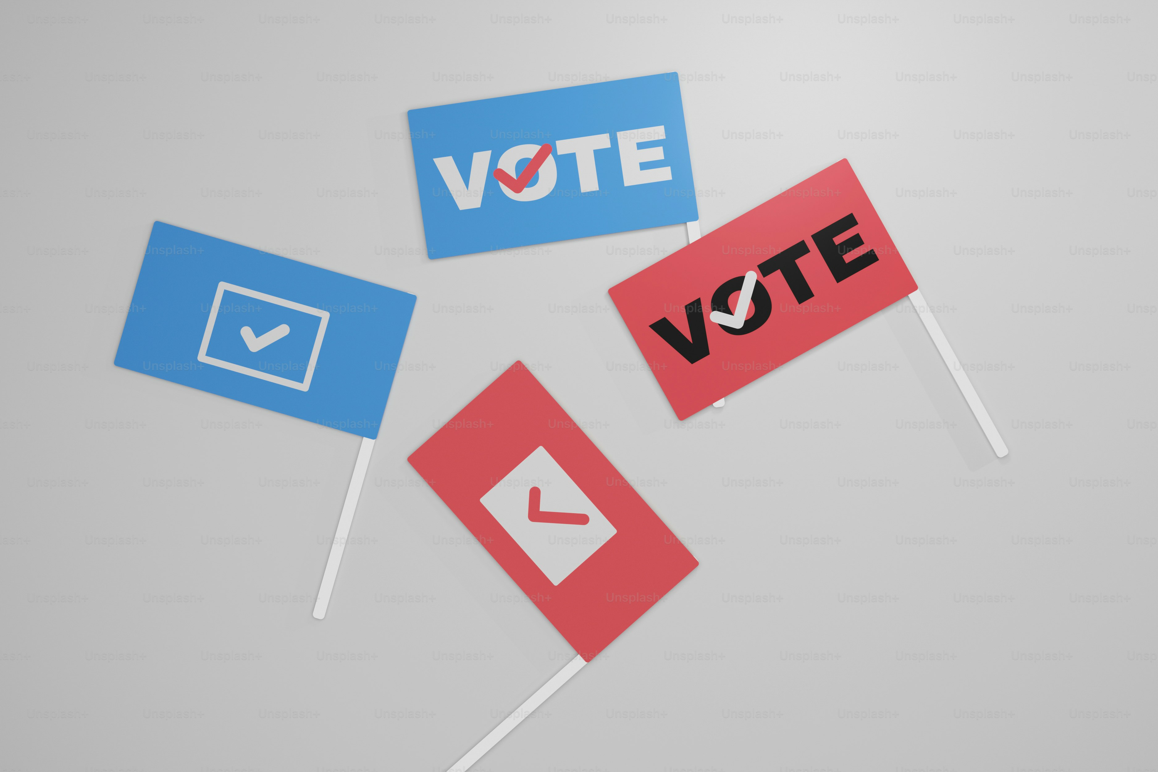 A group of vote signs sitting on top of a table photo – Vote Image on ...