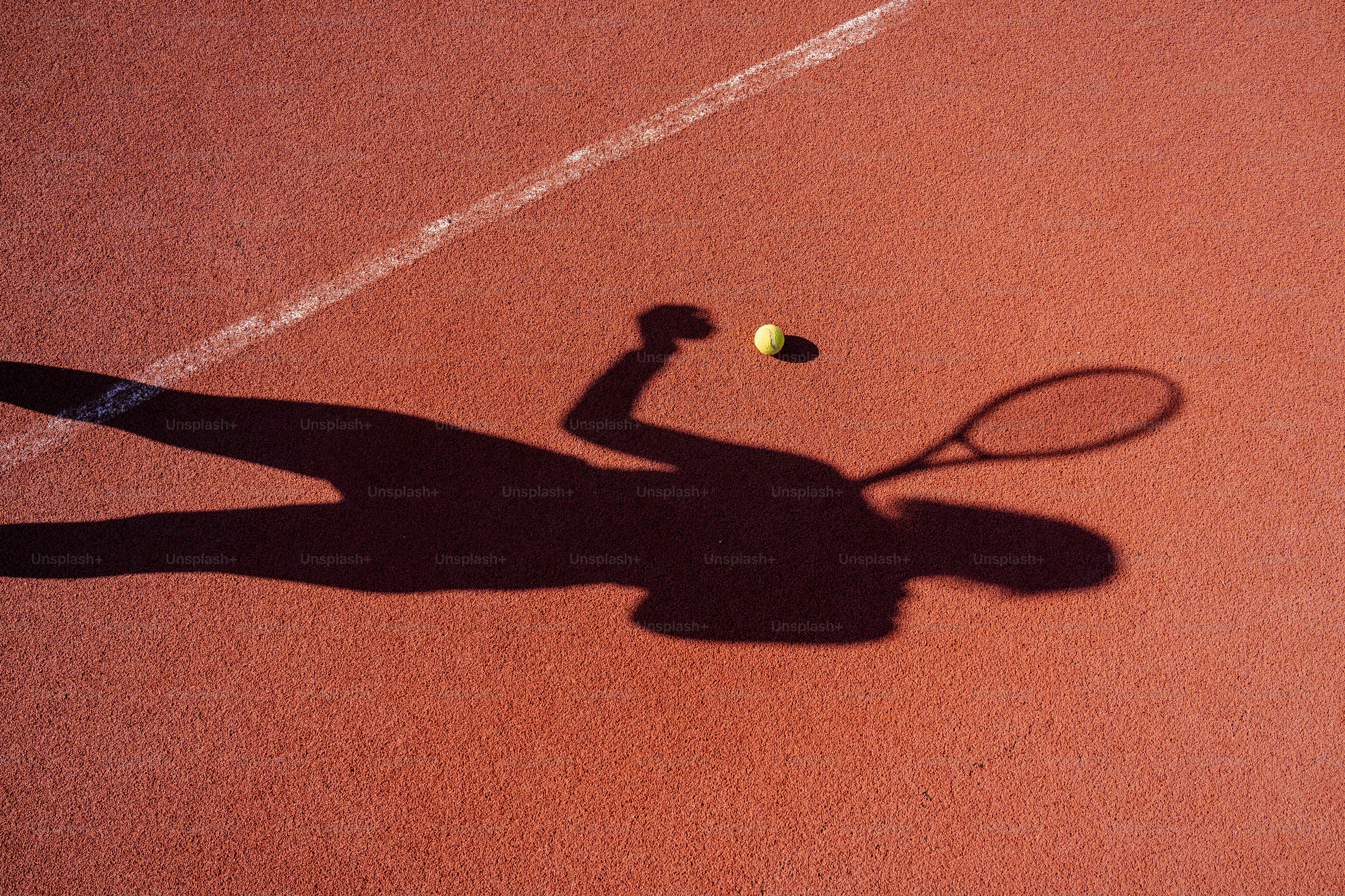 A shadow of a person holding a tennis racquet photo – Sport Image on ...
