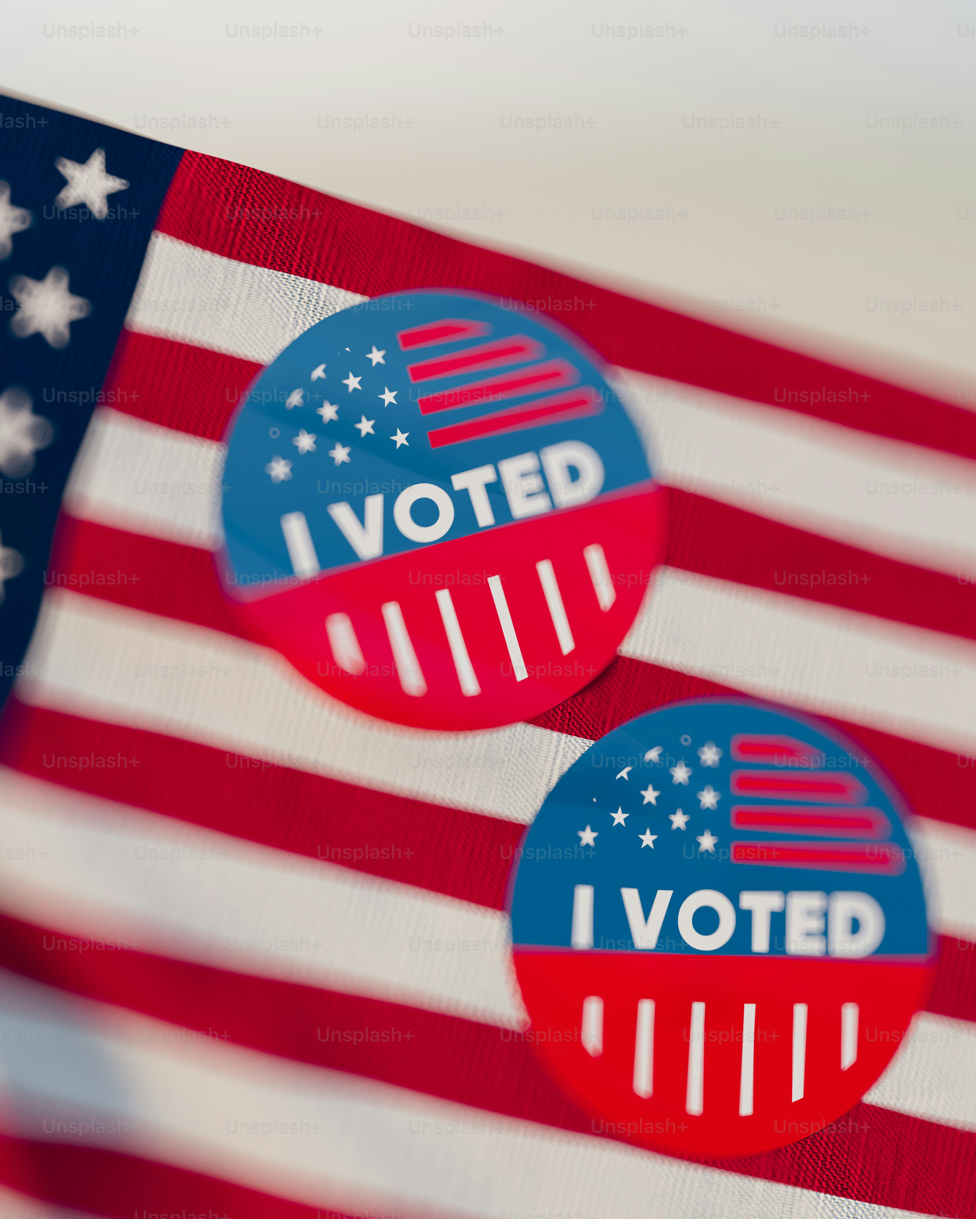 Two red, white and blue political buttons on a flag photo – Pin badge ...