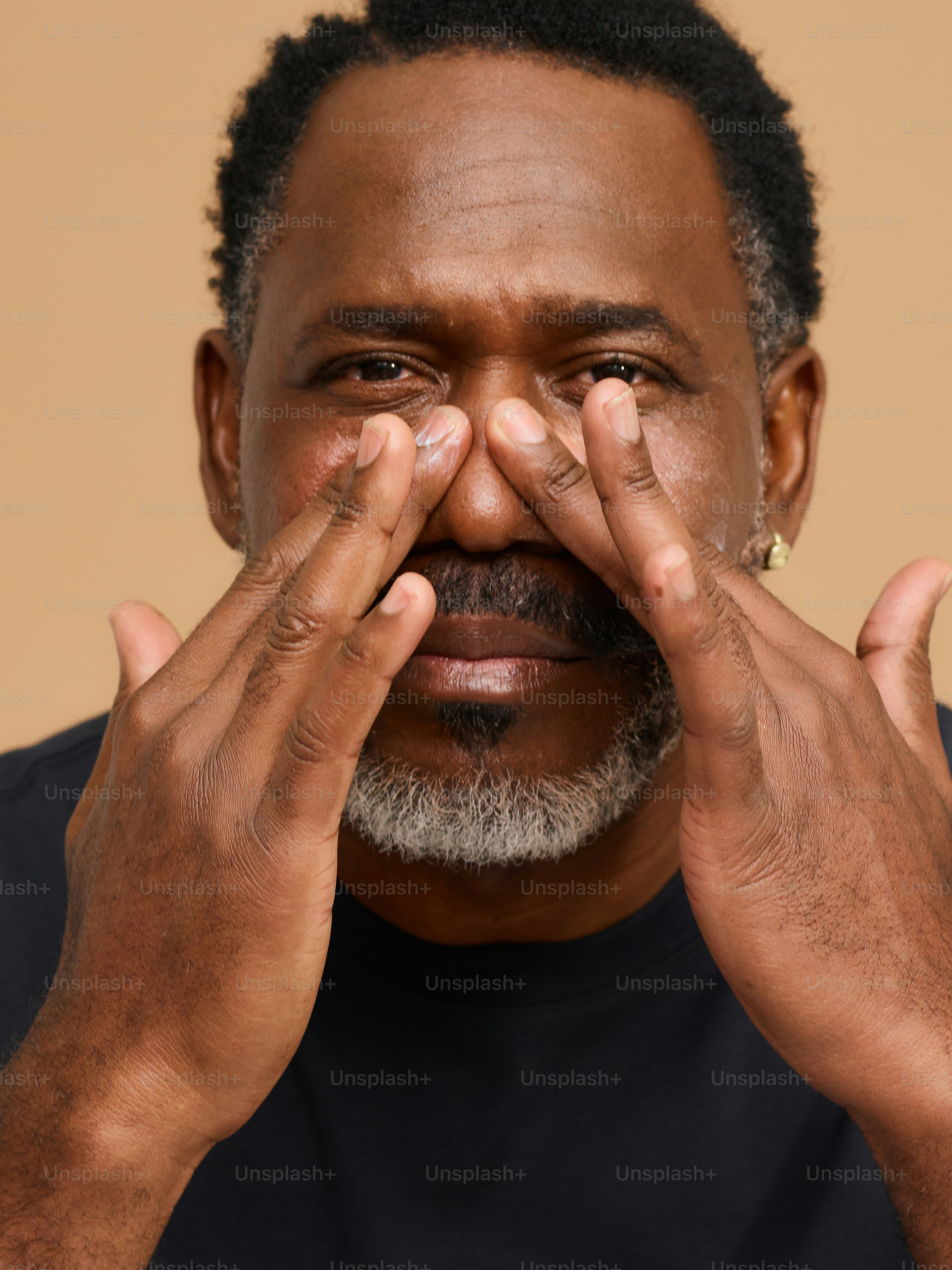 A man holding his hands to his face photo – Studio Image on Unsplash