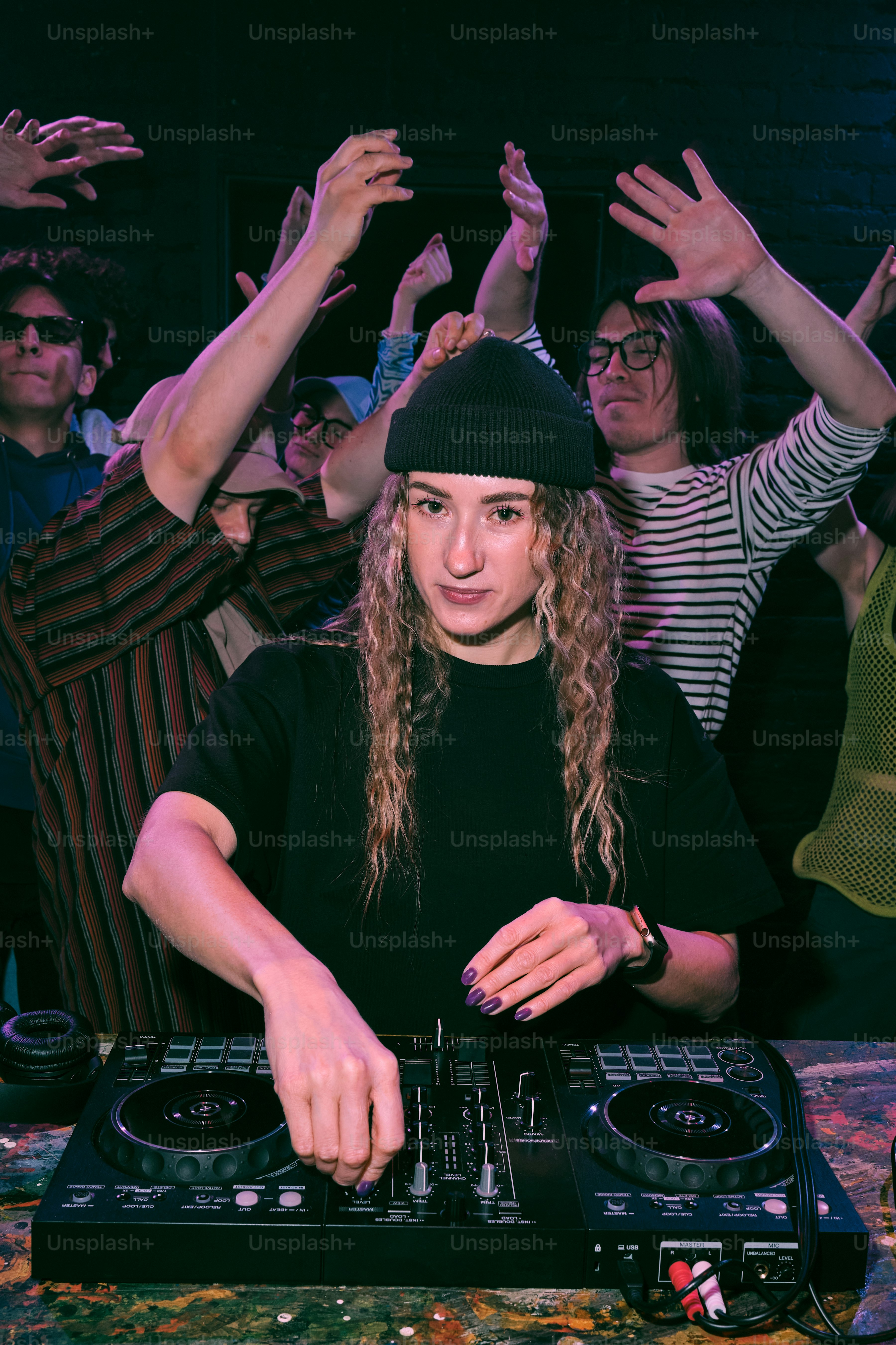 A woman djing at a party with her hands in the air photo – Dj Image on ...