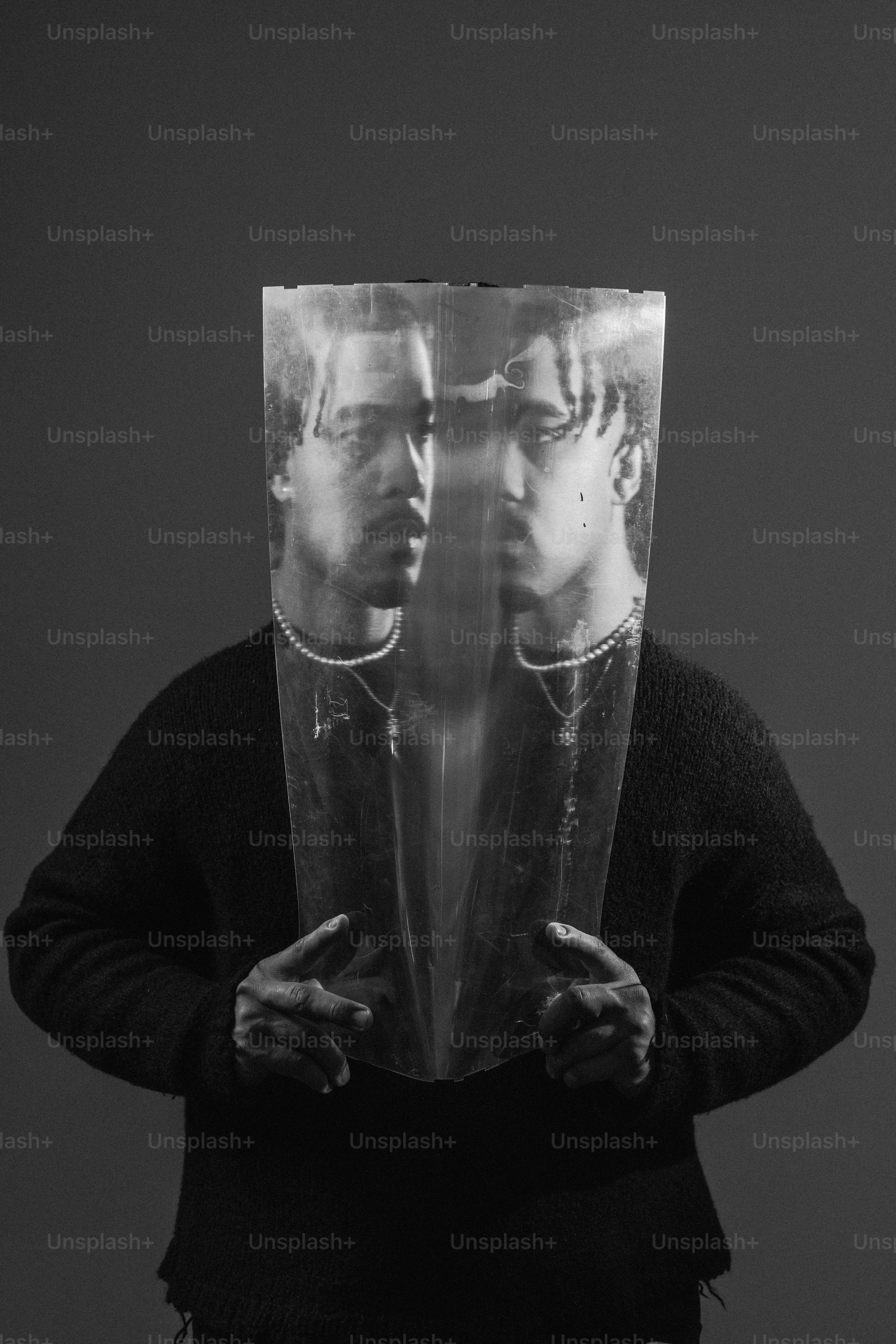 A woman holding a plastic bag over her face photo – Portrait Image on ...