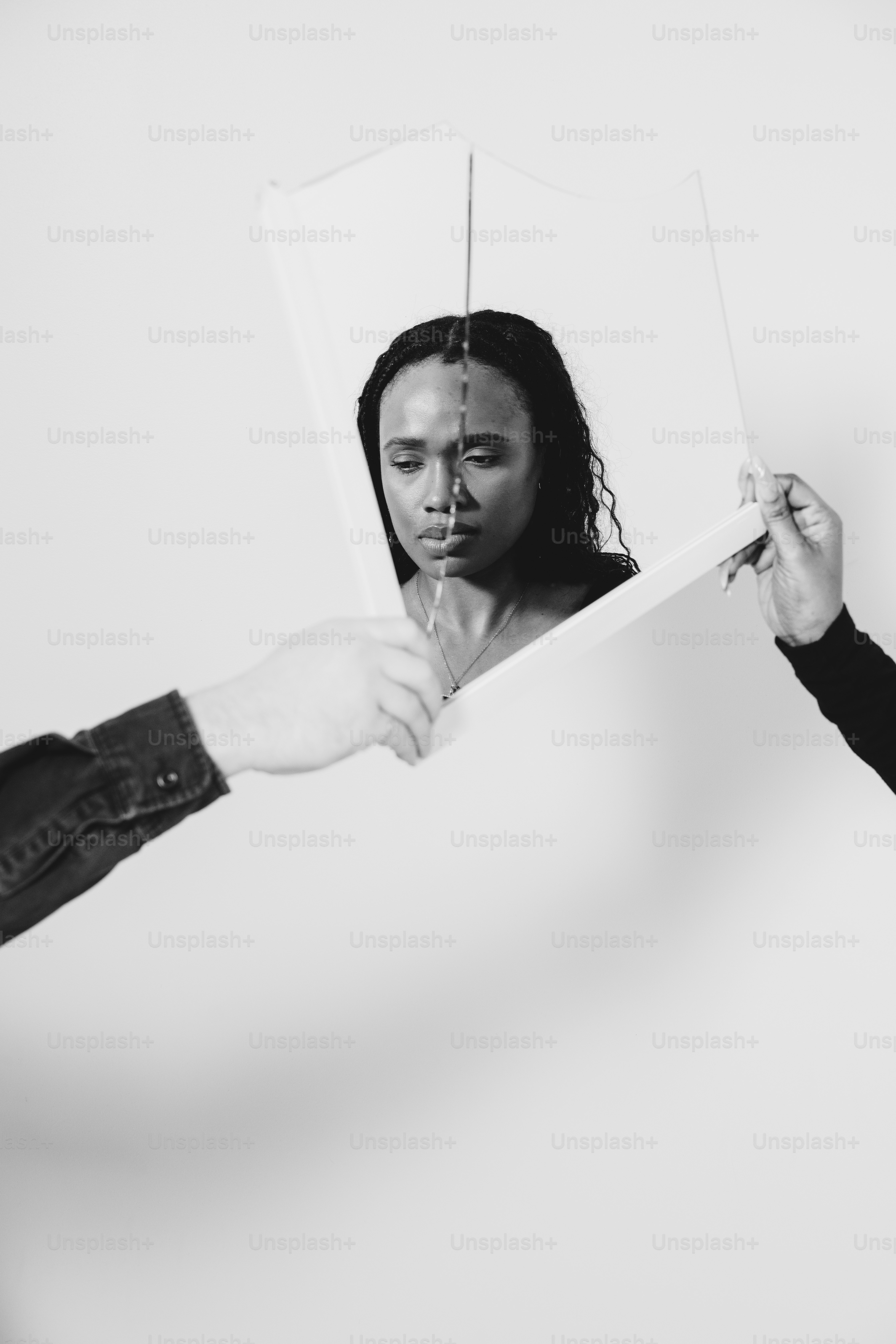 A person holding a mirror with a woman's face in it photo – Self ...