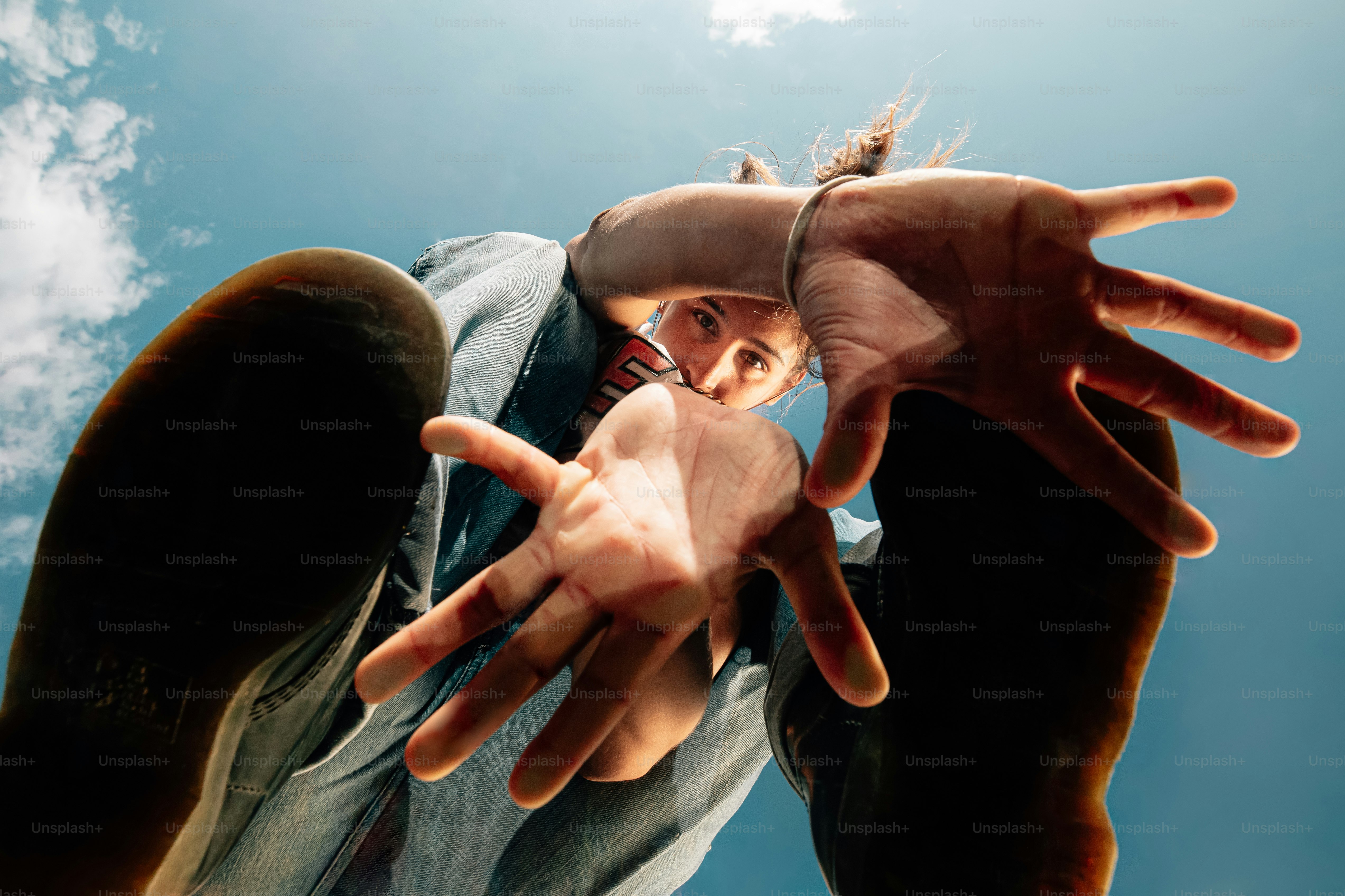 A person reaching up into the air with their hands photo – Dancing ...