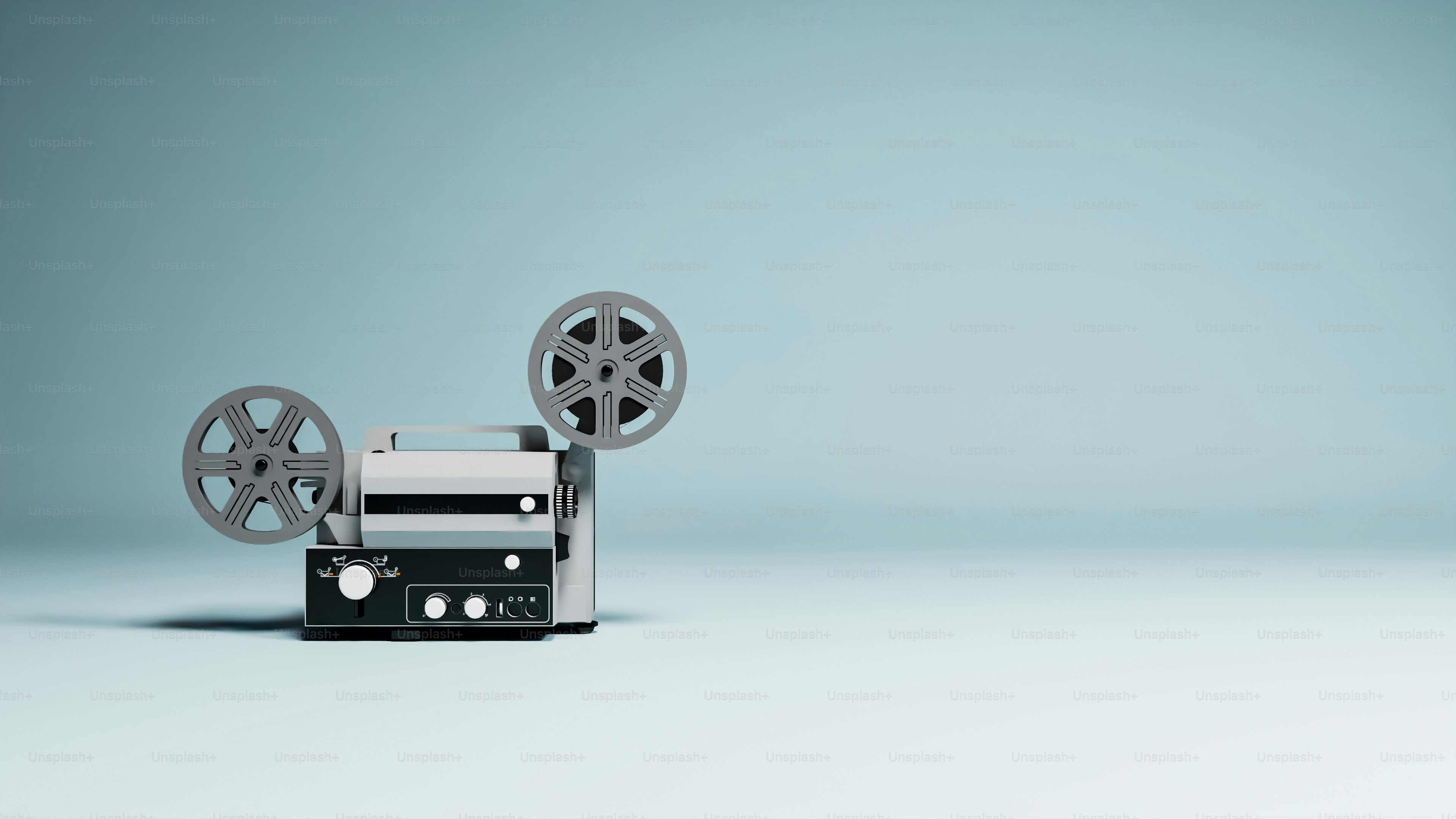 A film projector sitting on top of a table photo – Movie theater Image ...