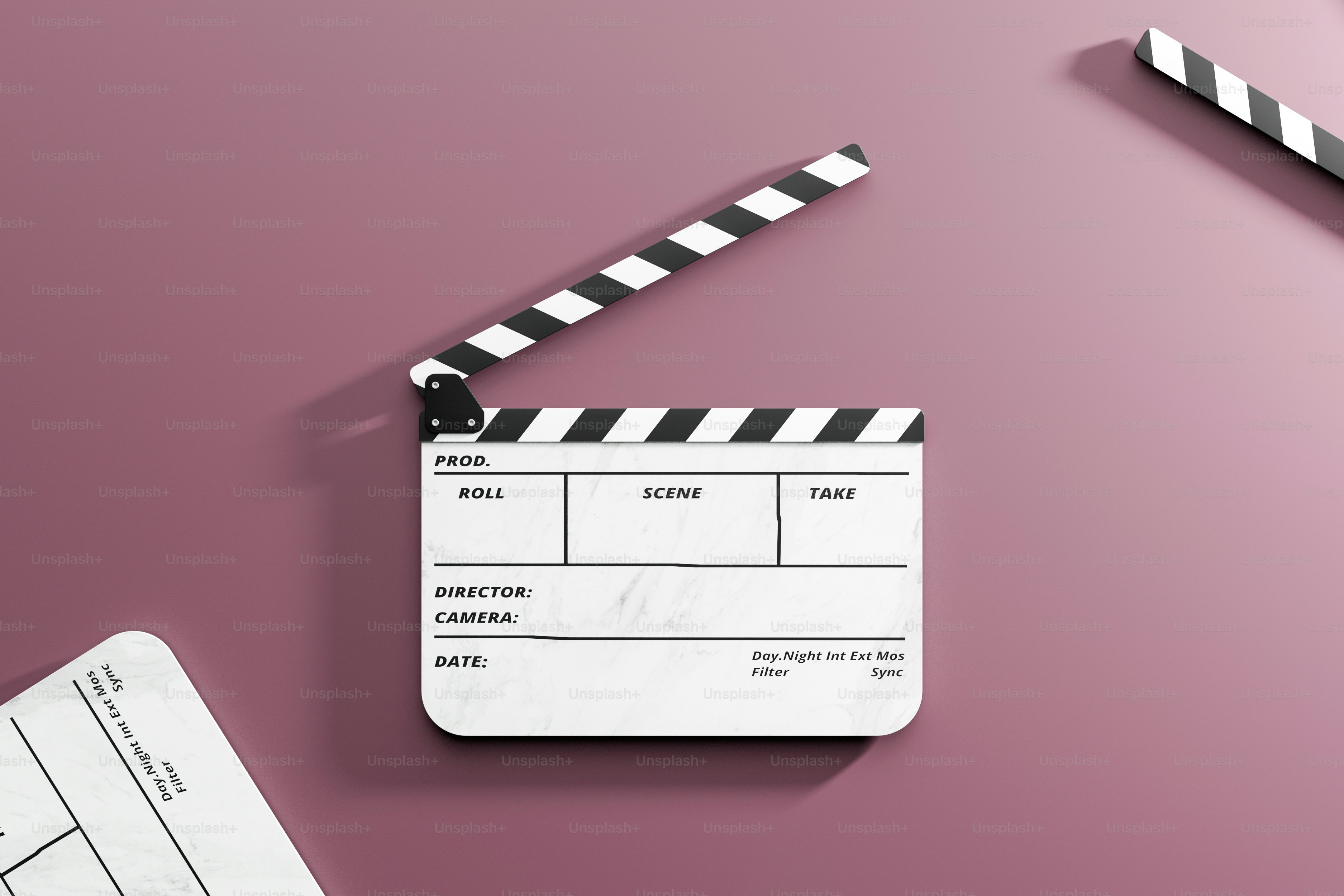 A movie clapper next to a pair of scissors photo – Film frame Image on ...