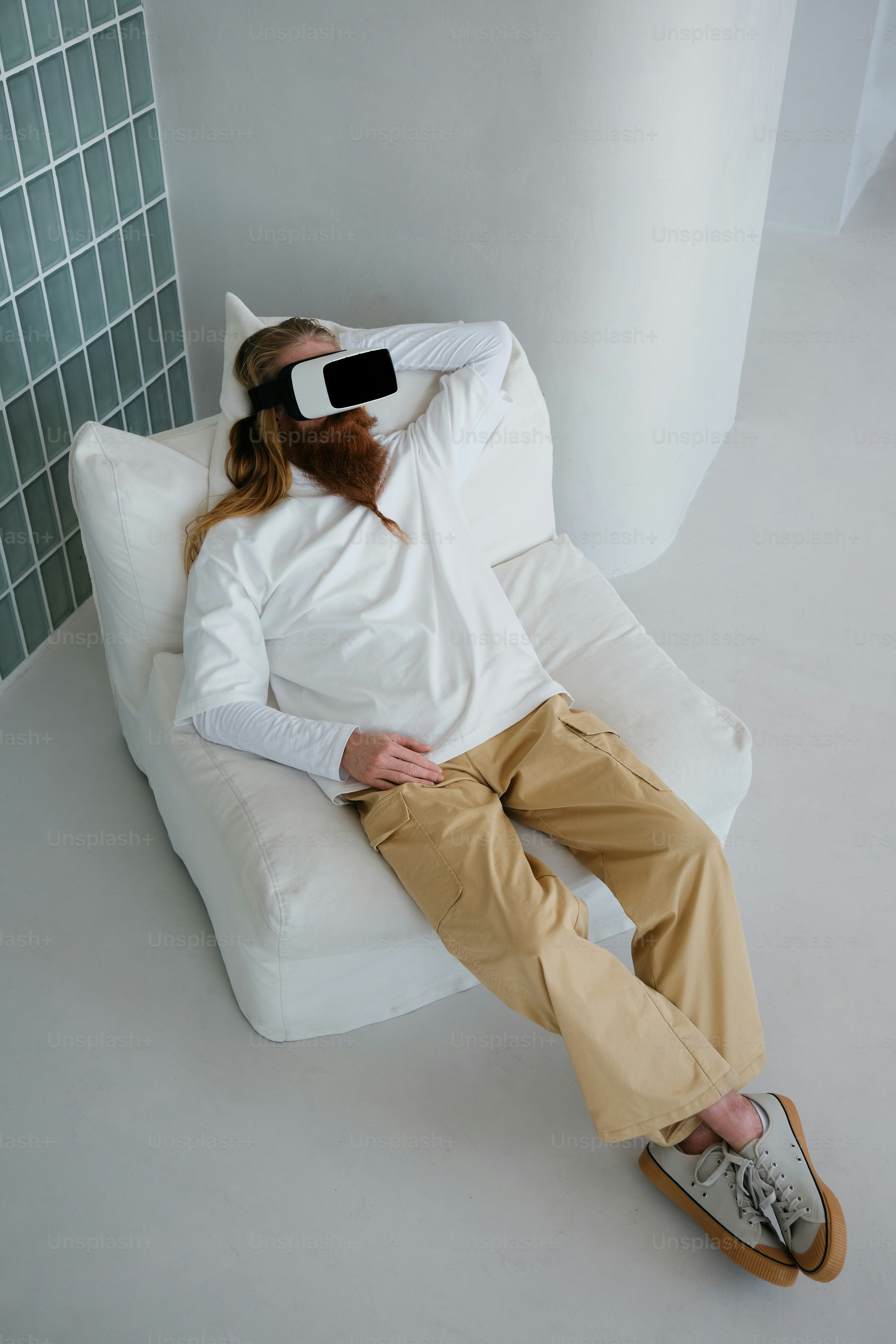 A person laying on a pillow with a blindfold photo – Vr headset Image ...