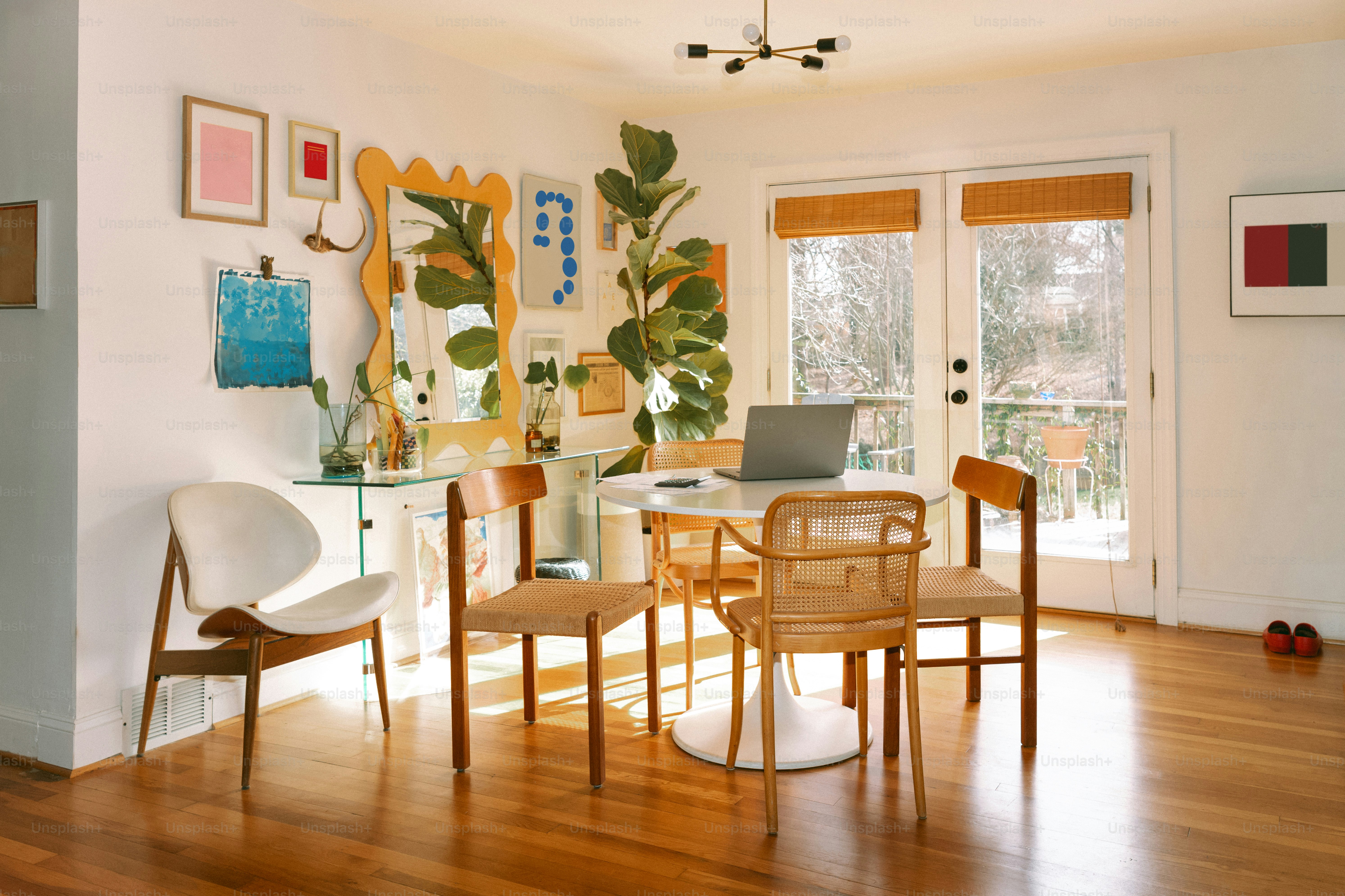 A room with a table, chairs, and a laptop photo – Remote working Image ...