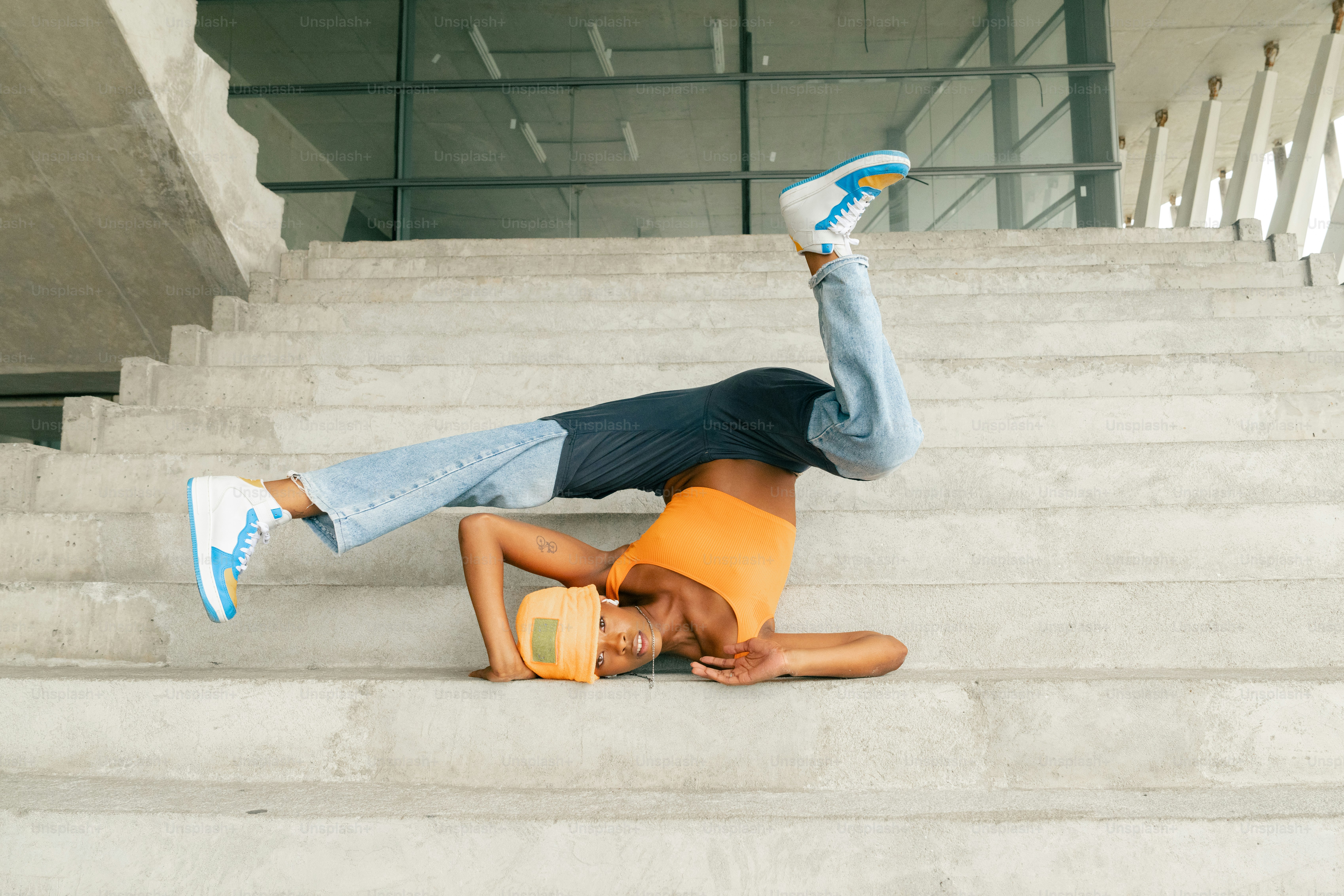 A man laying on top of a set of stairs photo – Dancing Image on Unsplash