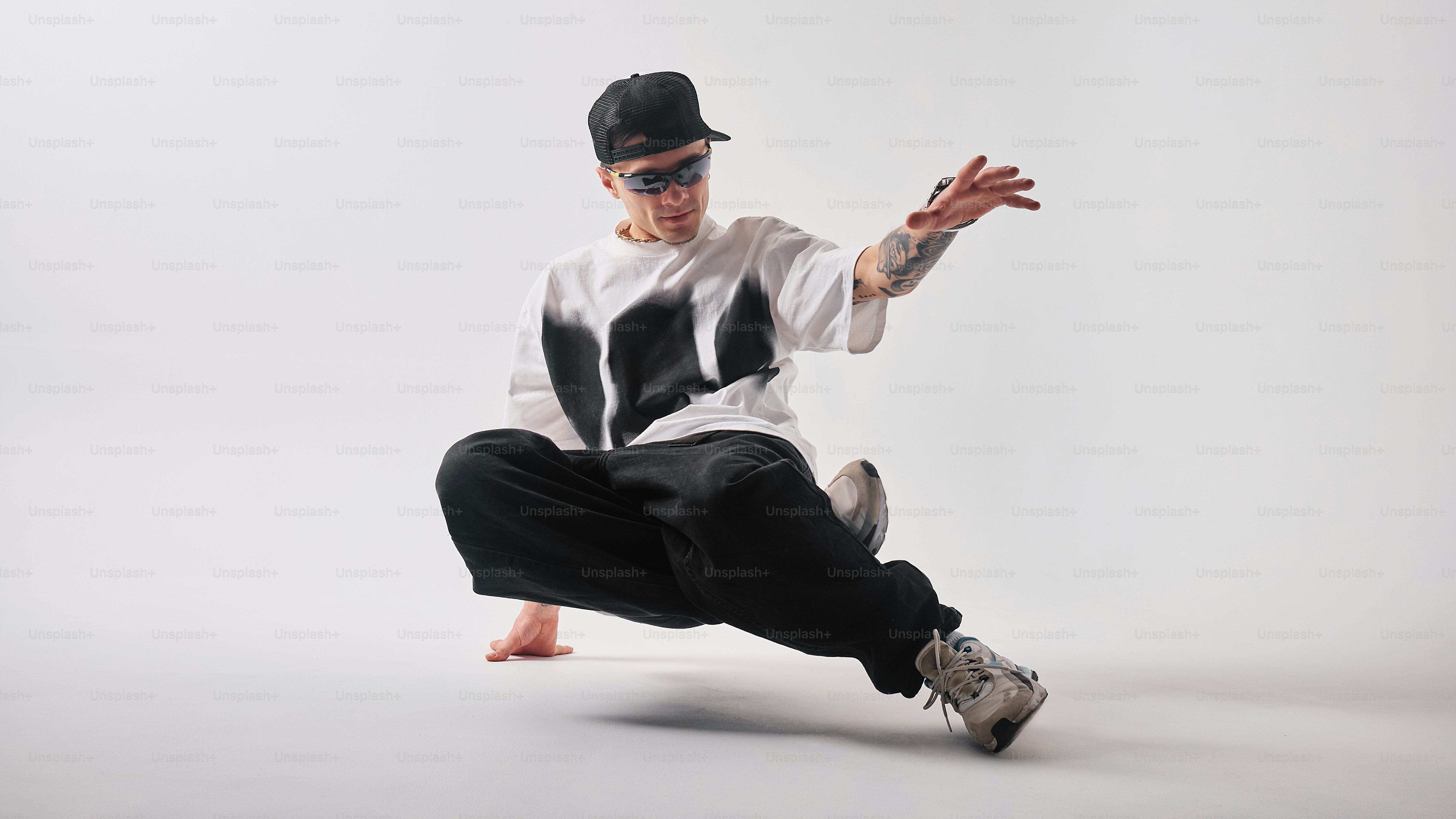 A man in black and white is doing a trick photo – Dancing Image on Unsplash