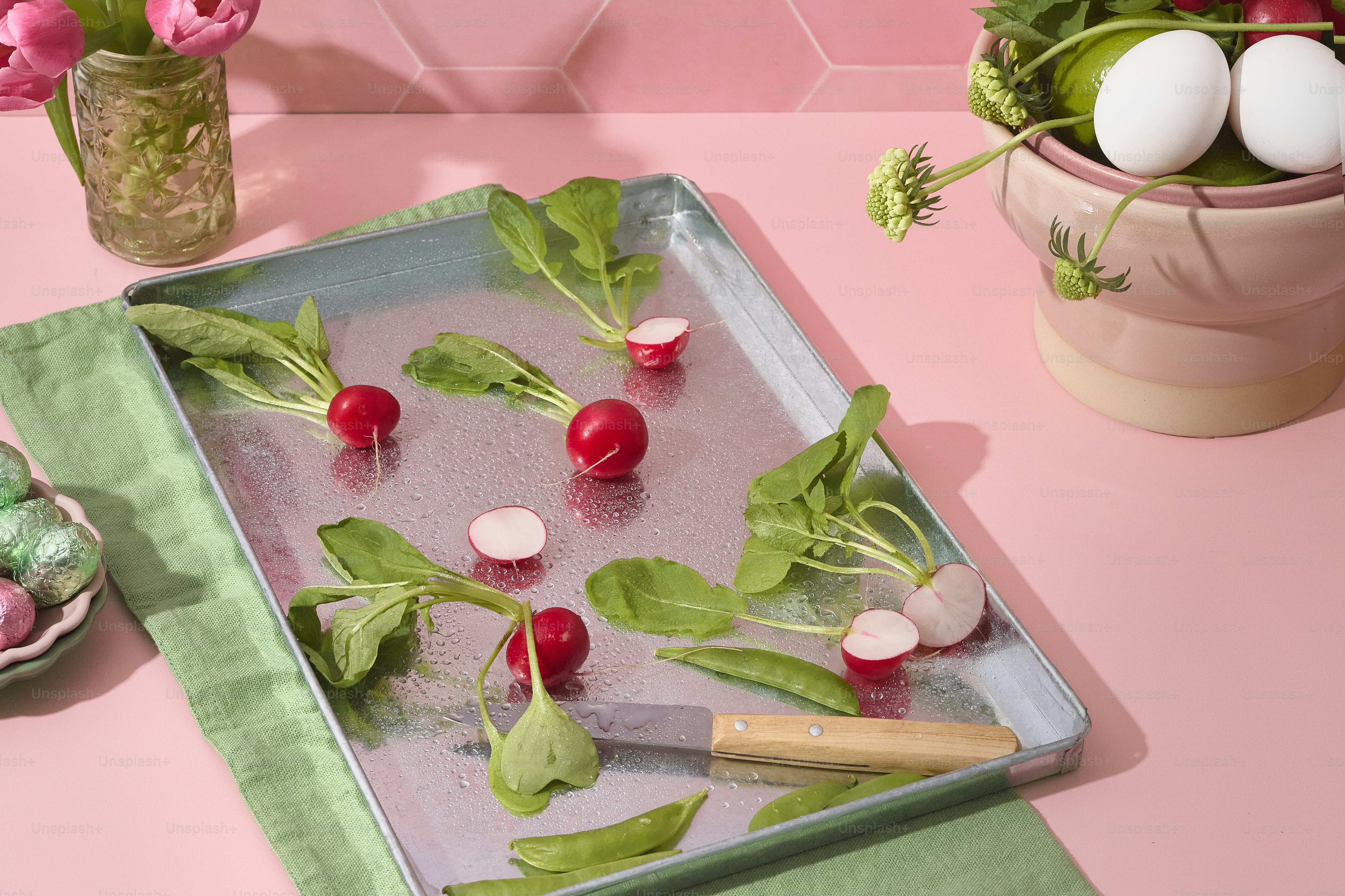 A tray with radishes and other vegetables on it photo – Healthy greens ...