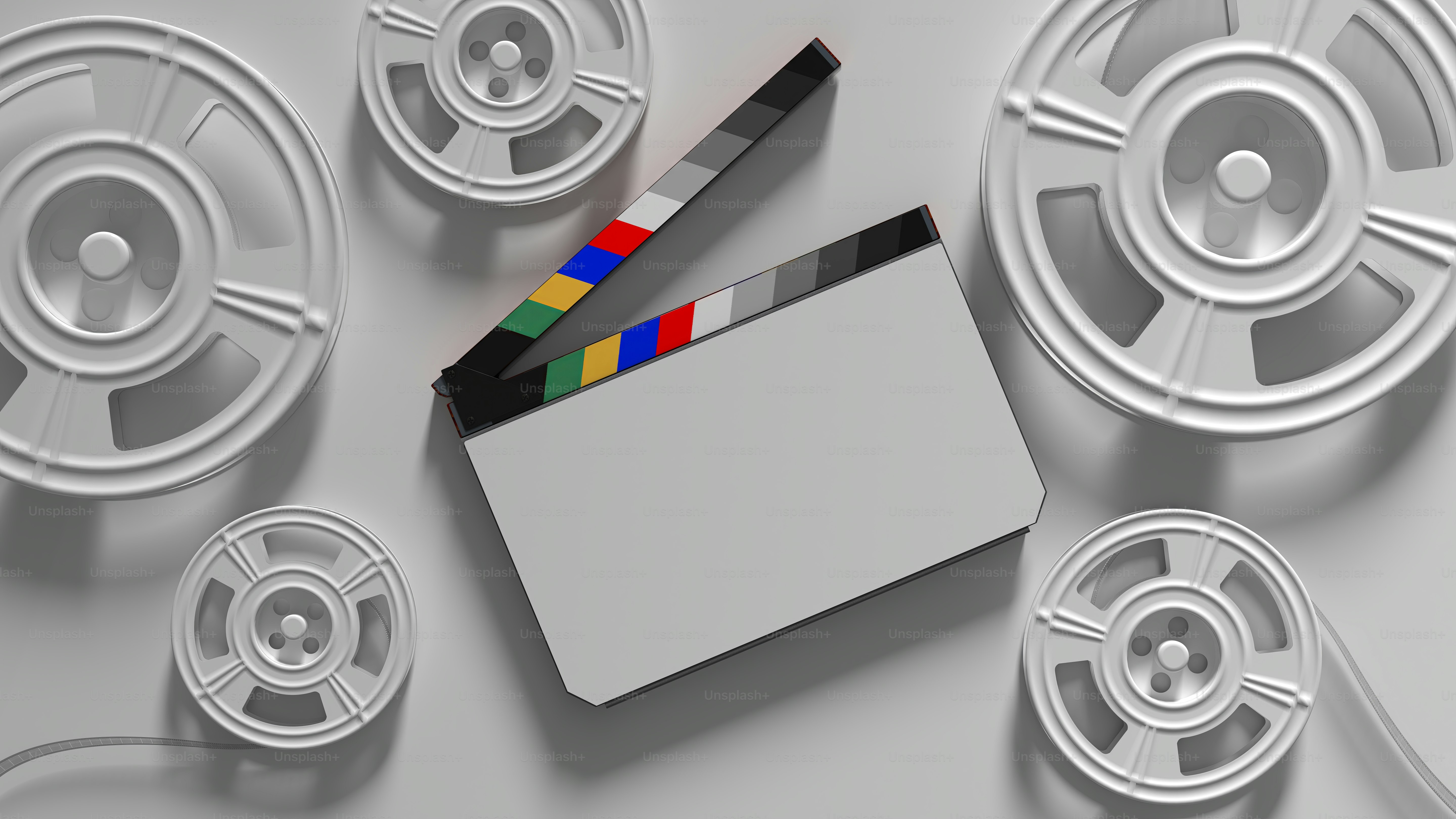 A film clapper and some reels on a table photo – Movie Image on Unsplash