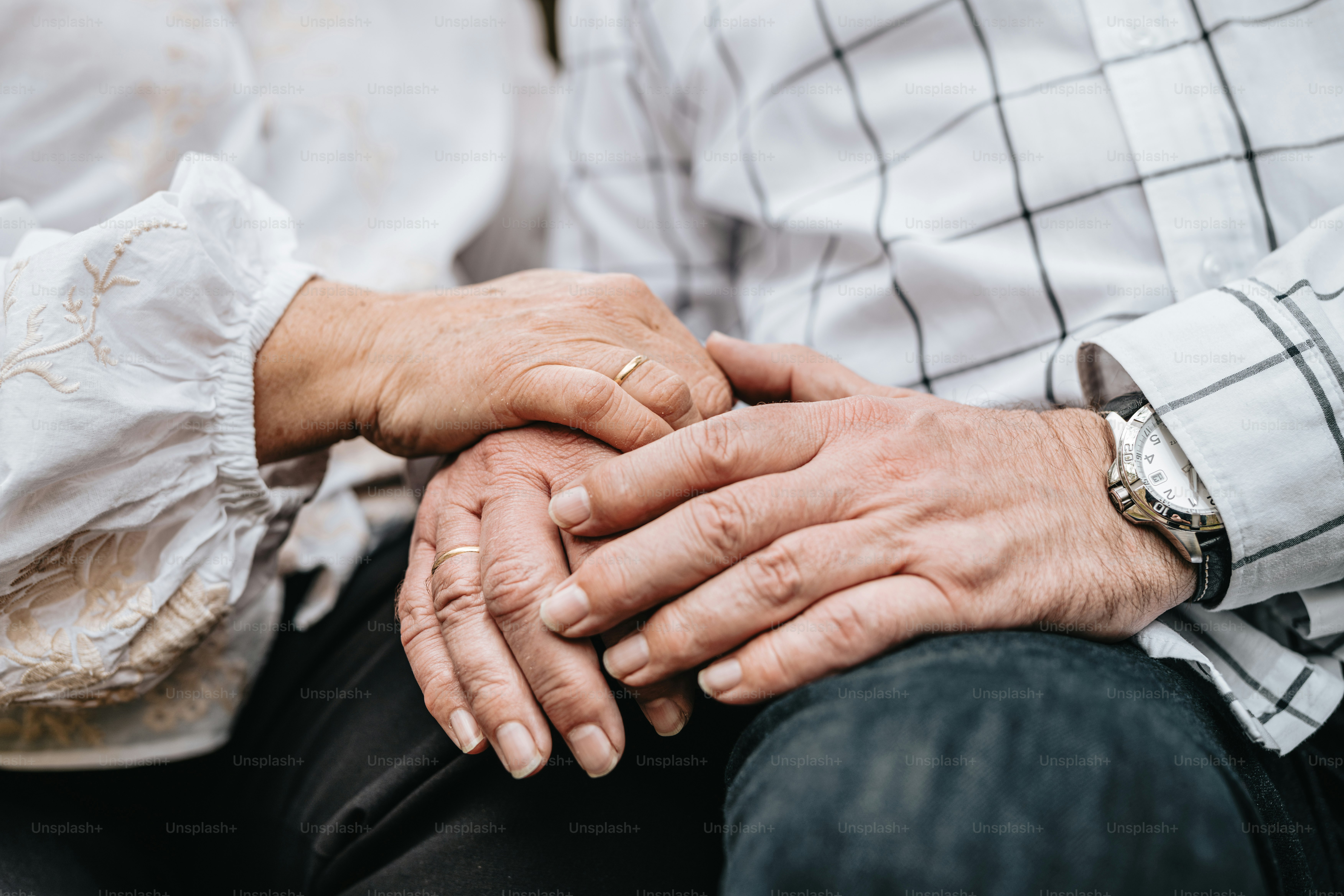 A close up of two people holding hands photo – Wedding anniversary ...