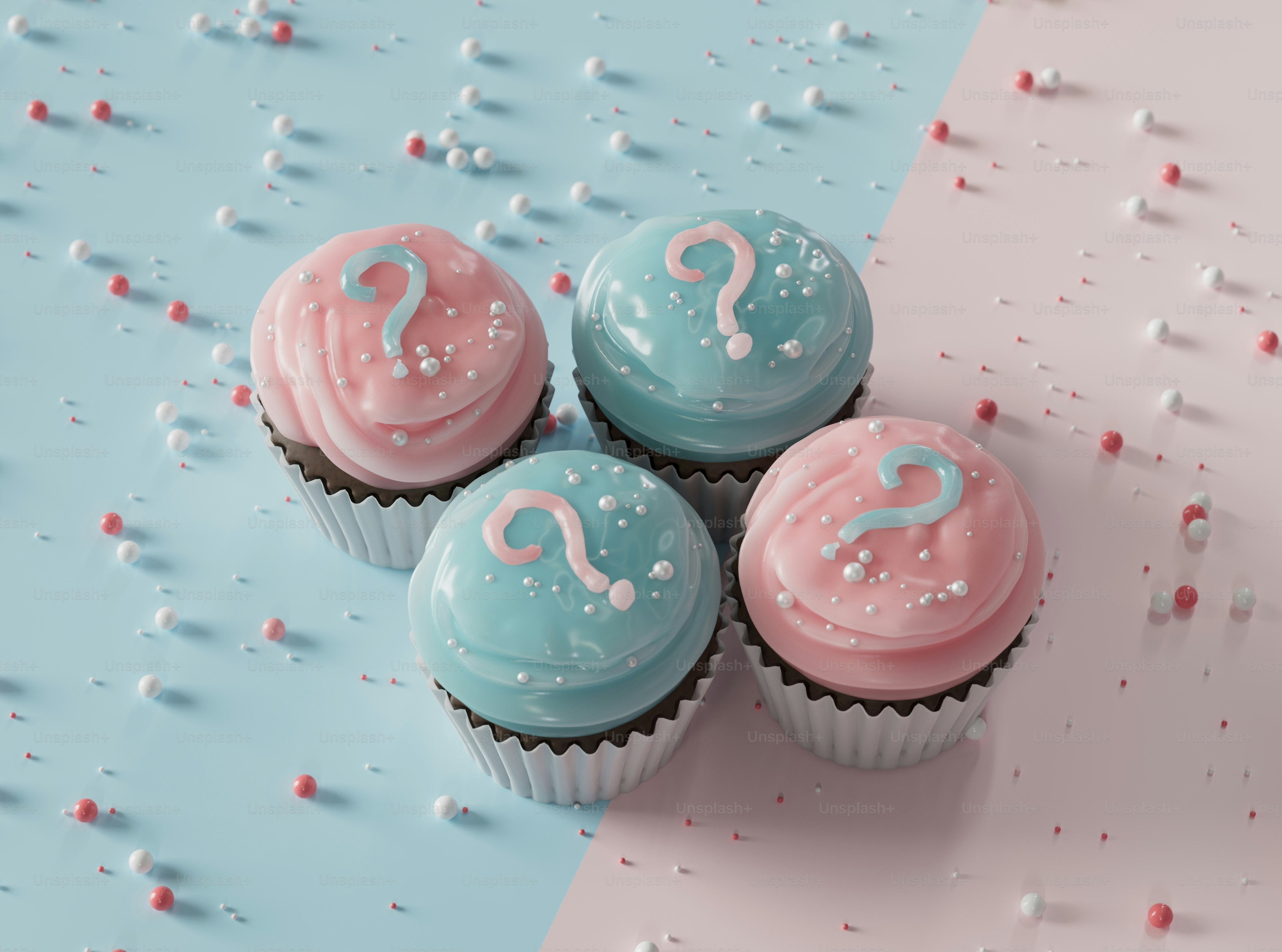 Three cupcakes with frosting and a question mark on them photo ...