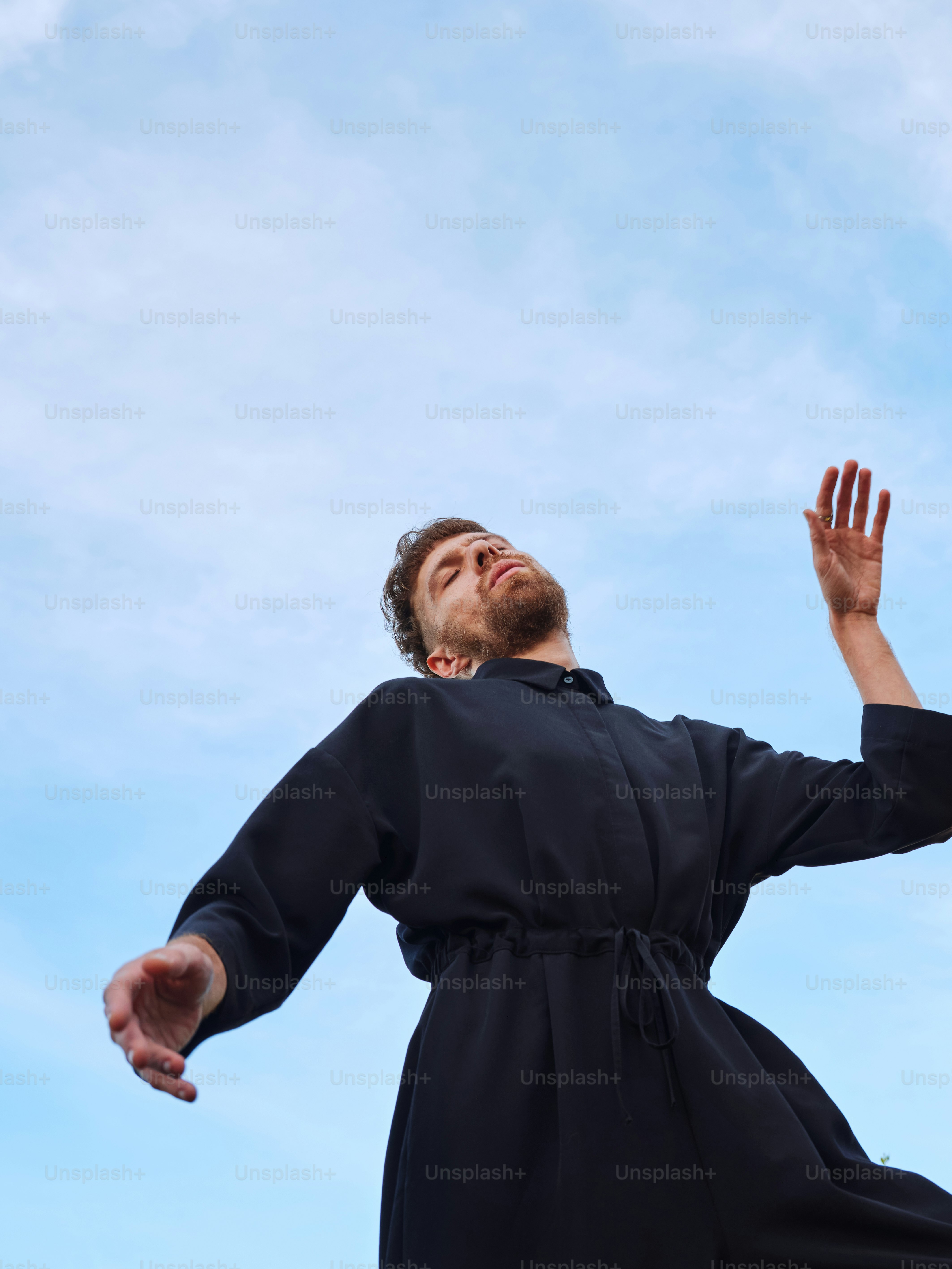 A man reaching up to catch a frisbee photo – Gay man Image on Unsplash
