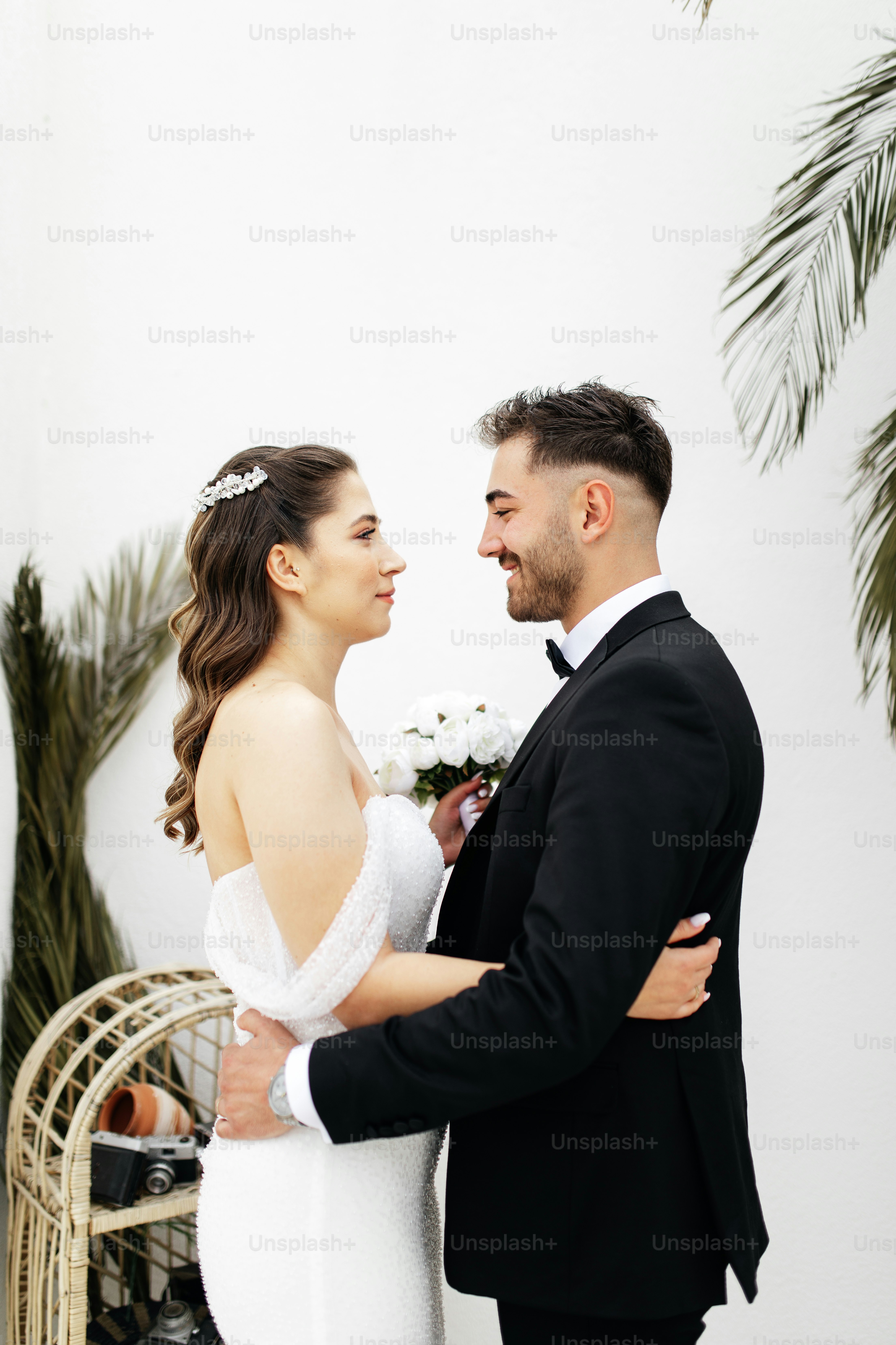 A bride and groom standing next to each other photo – Wedding Image on ...