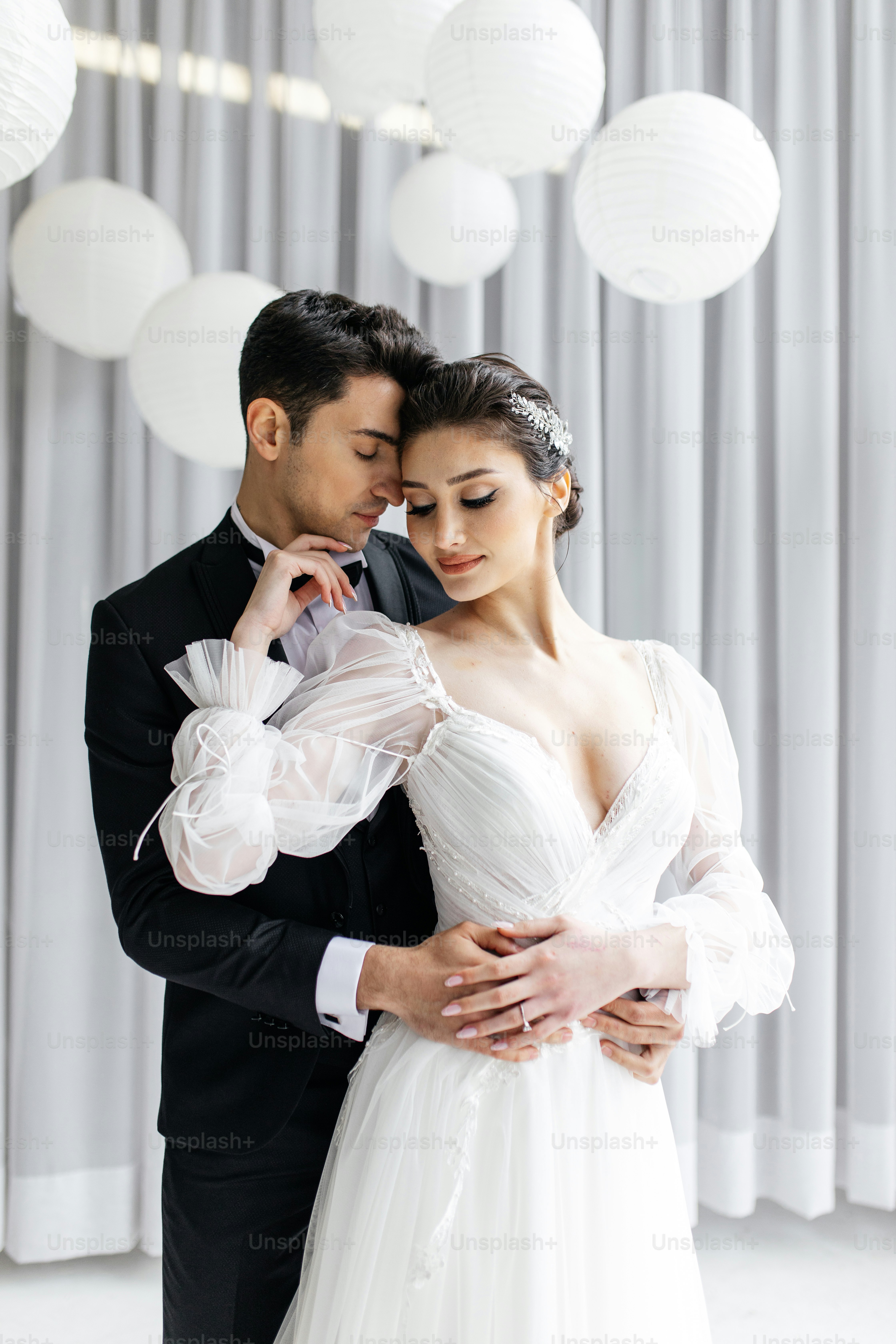 A bride and groom pose for a wedding photo photo – Wedding Image on ...