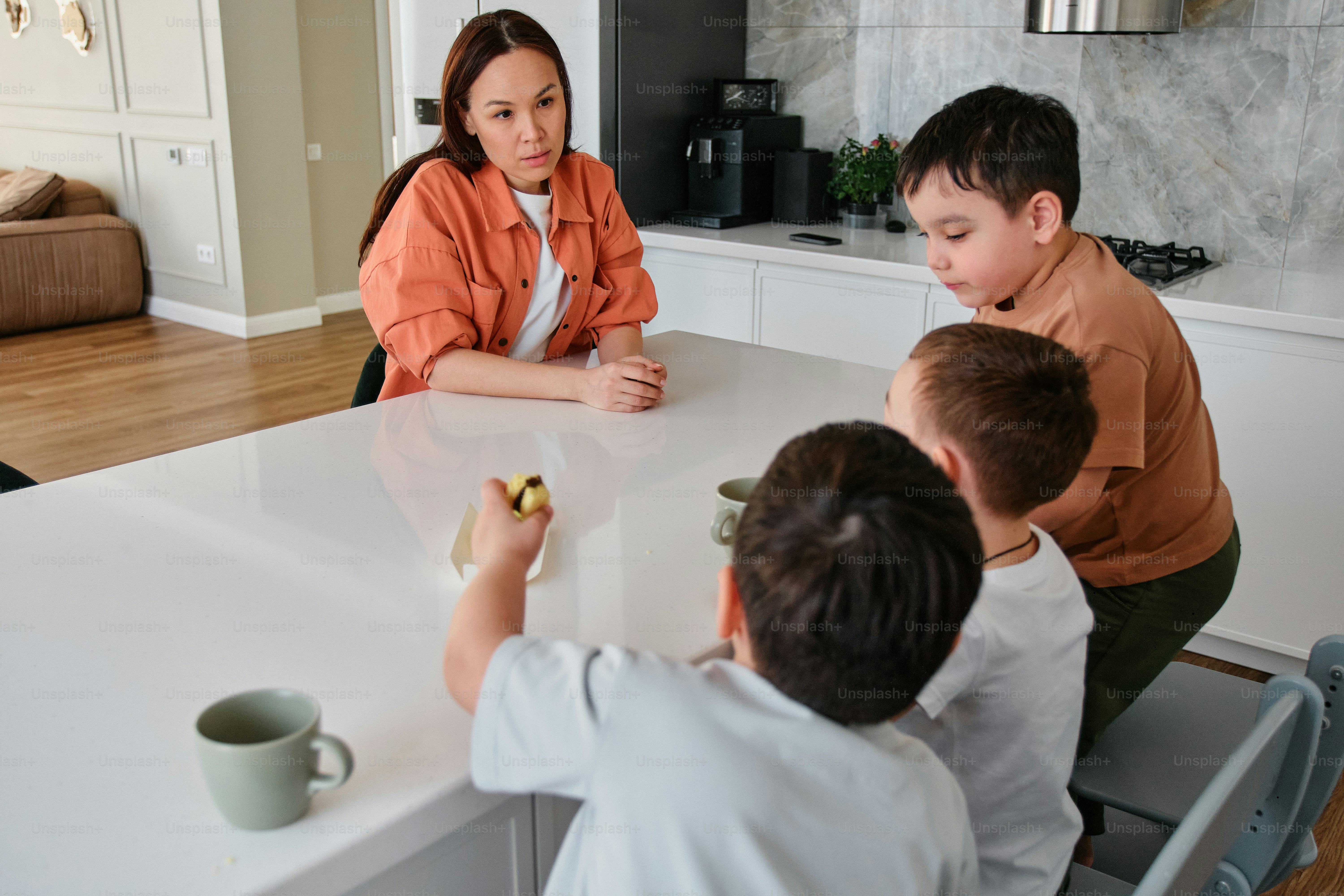 A group of children sitting around a white table photo – Kids Image on ...